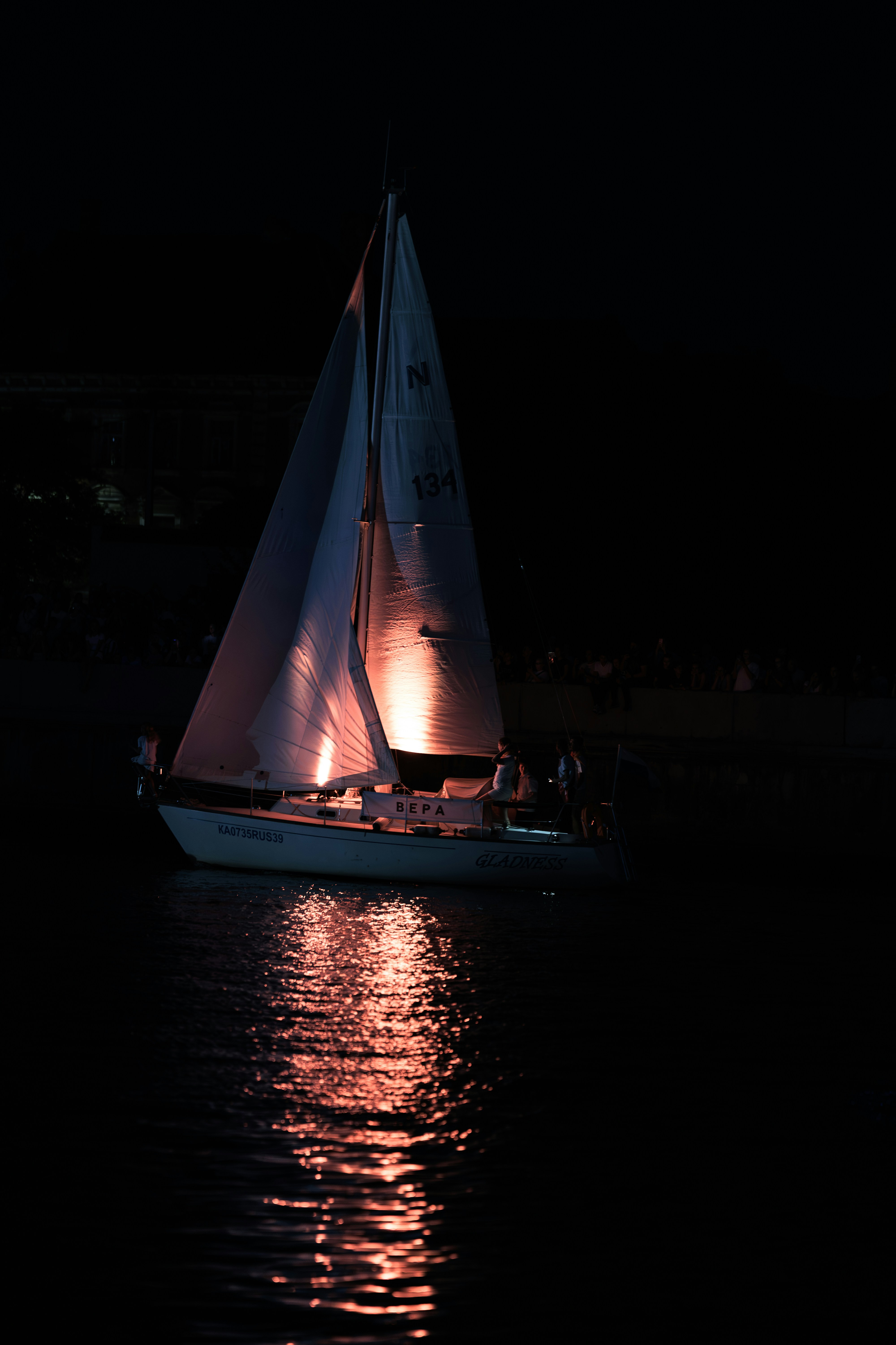 Moonlit Sail: A Glimmering Reflection on Quiet Waters