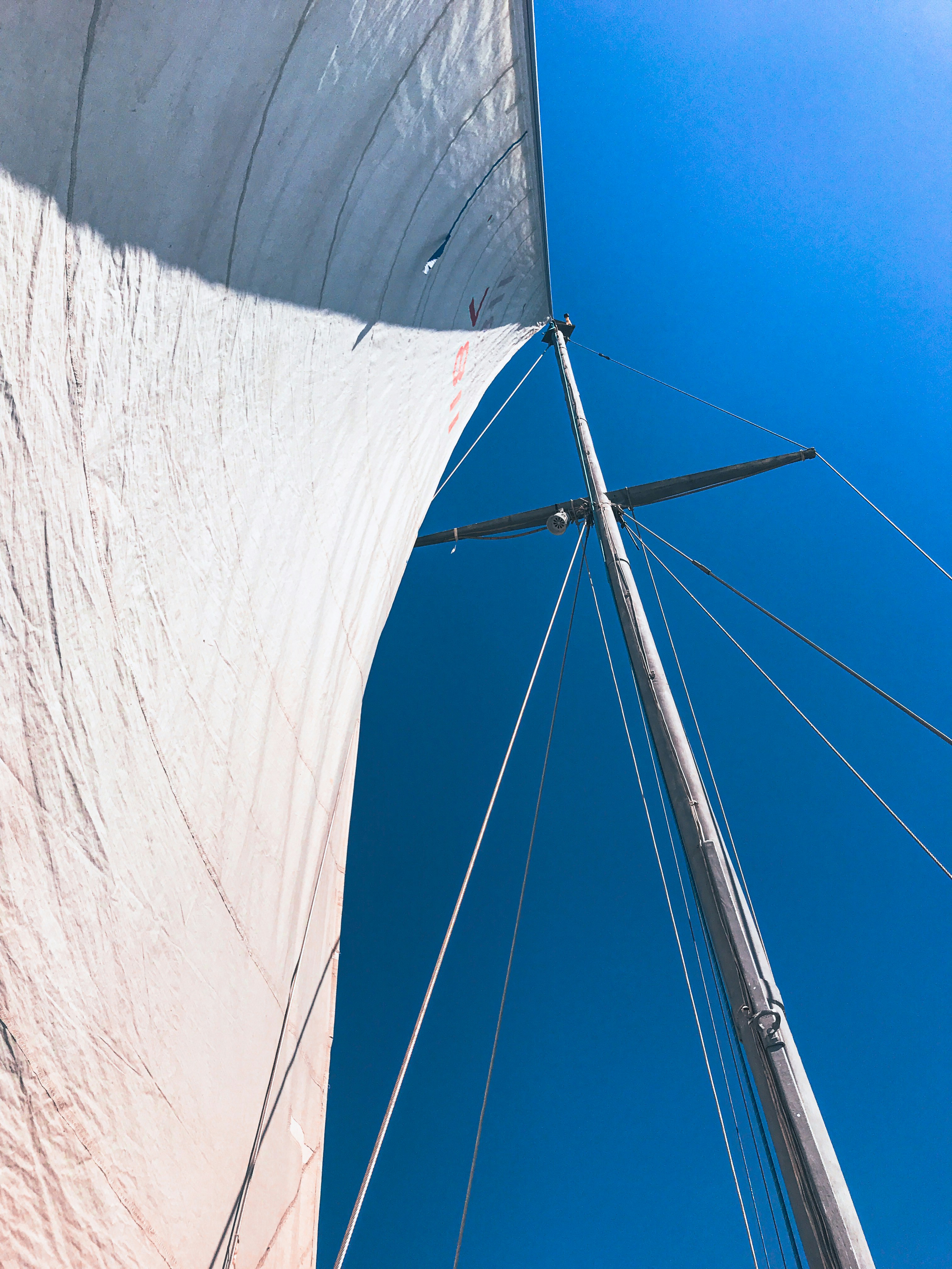 Sail Mast Reaching Toward a Clear Blue Zenith