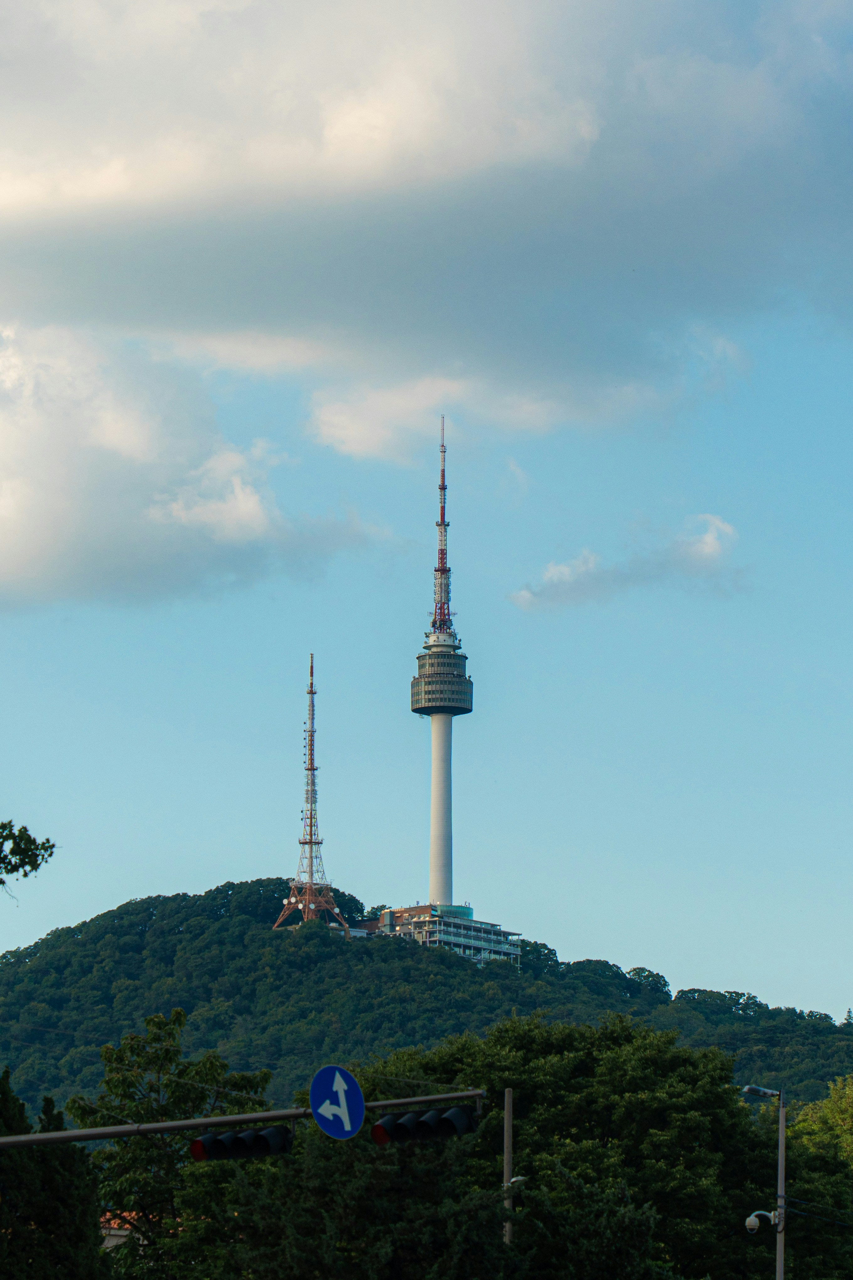 Towered Silence: A TV Spire Reigns Over a Green Hill