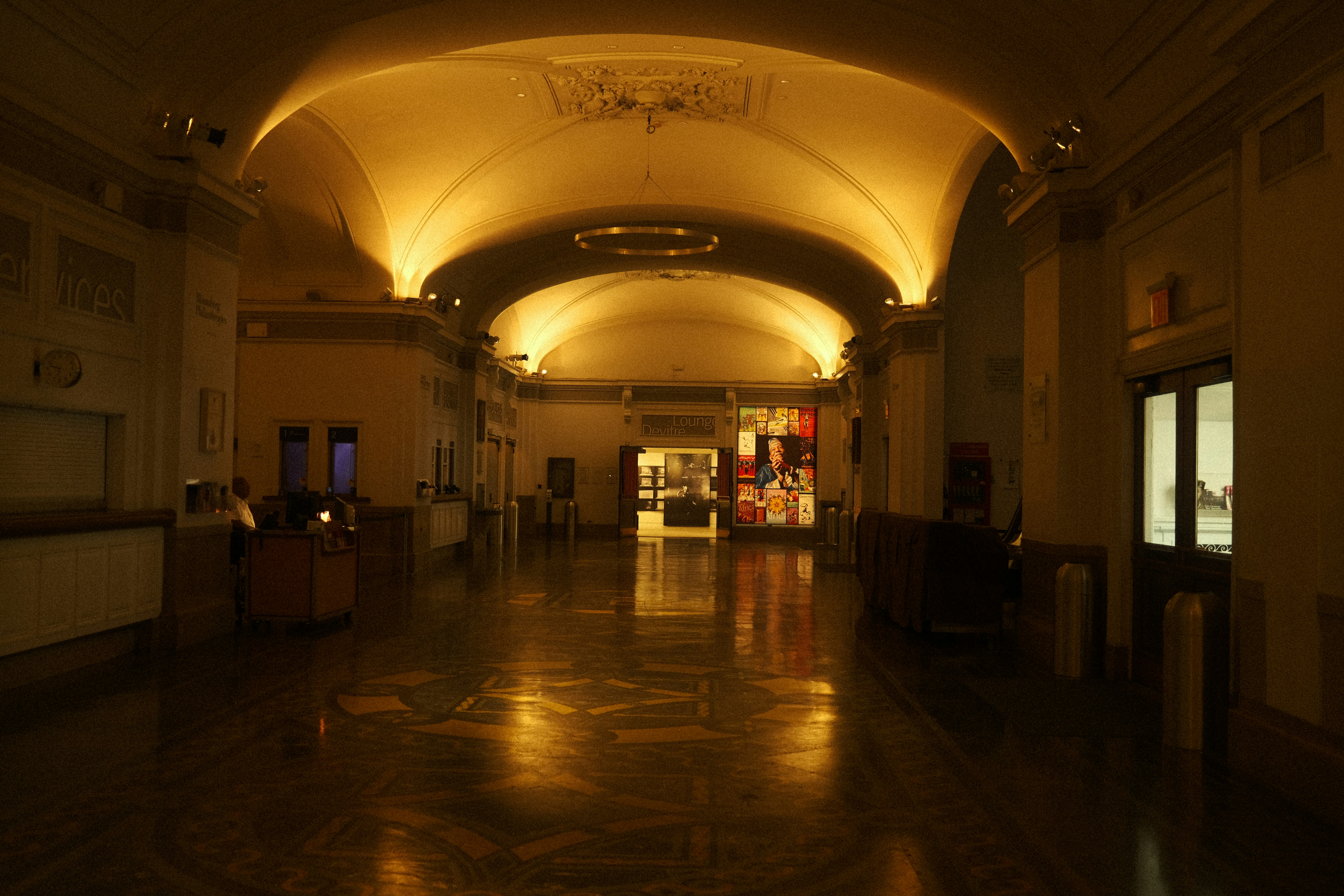 Warmen Hallway: Amber Glow Over An Empty Transit Atrium