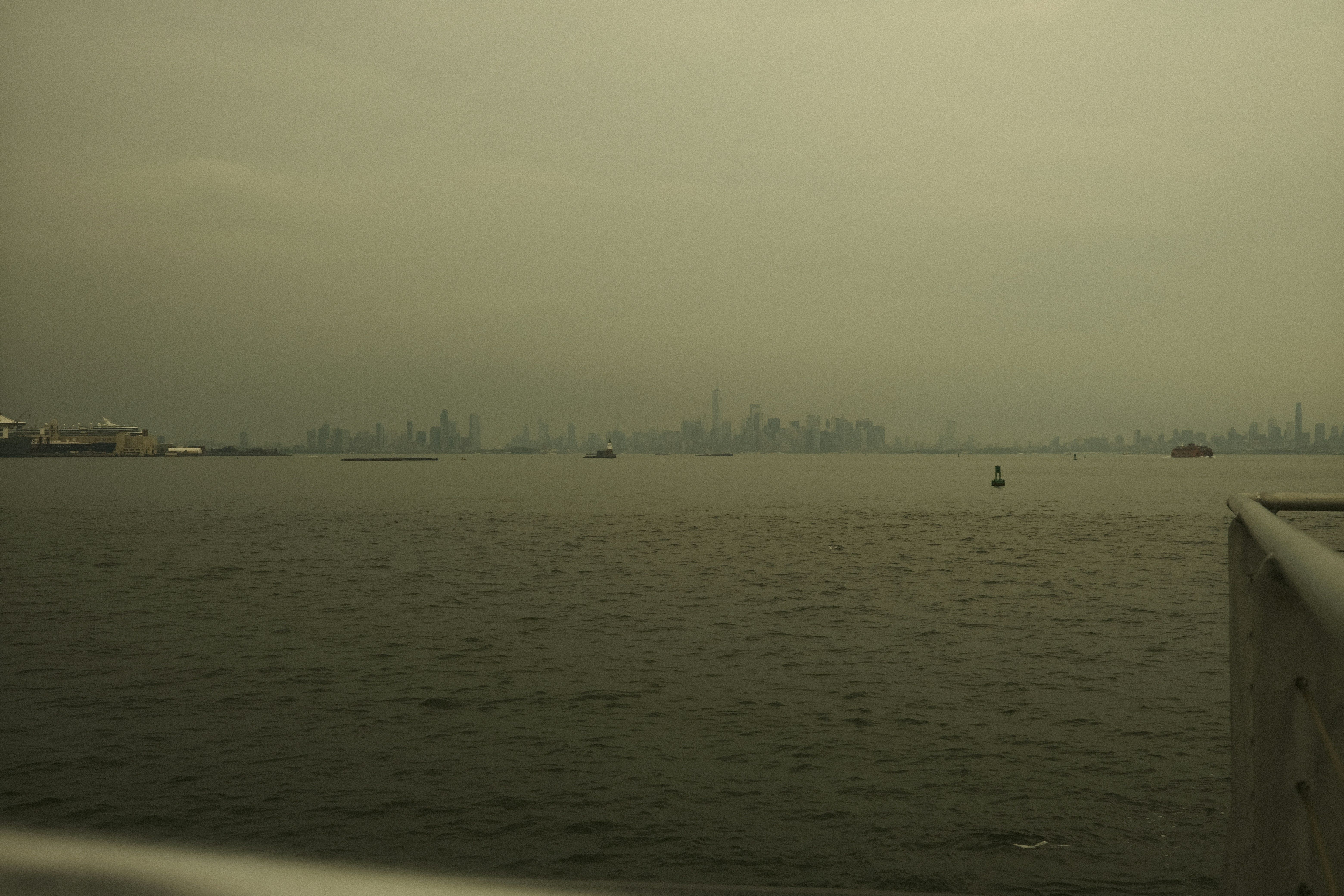 Mumbai Horizon: A Foggy Waterfront from the Pier