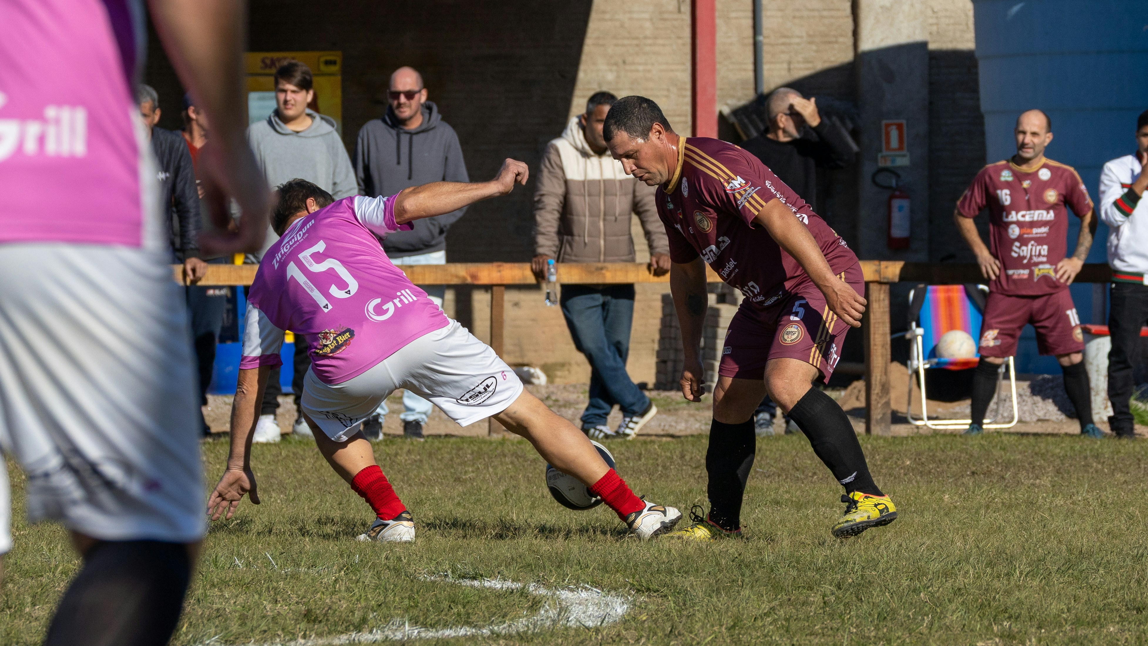 Soccer players compete for the ball during an outdoor game. photo ...