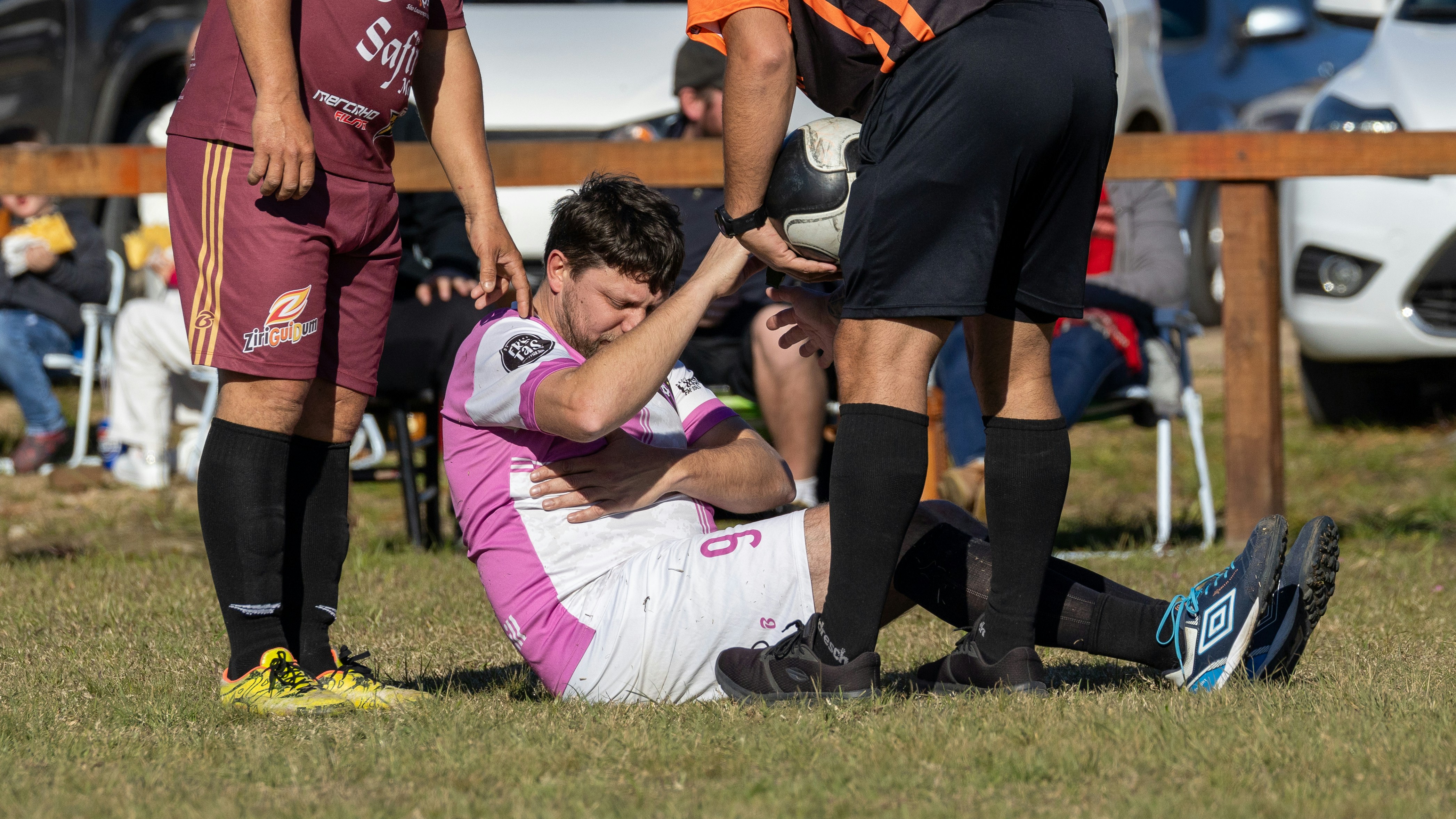 Downed Player Seeks Grounded Victory: A Rugby Moment of Friction and Resolve