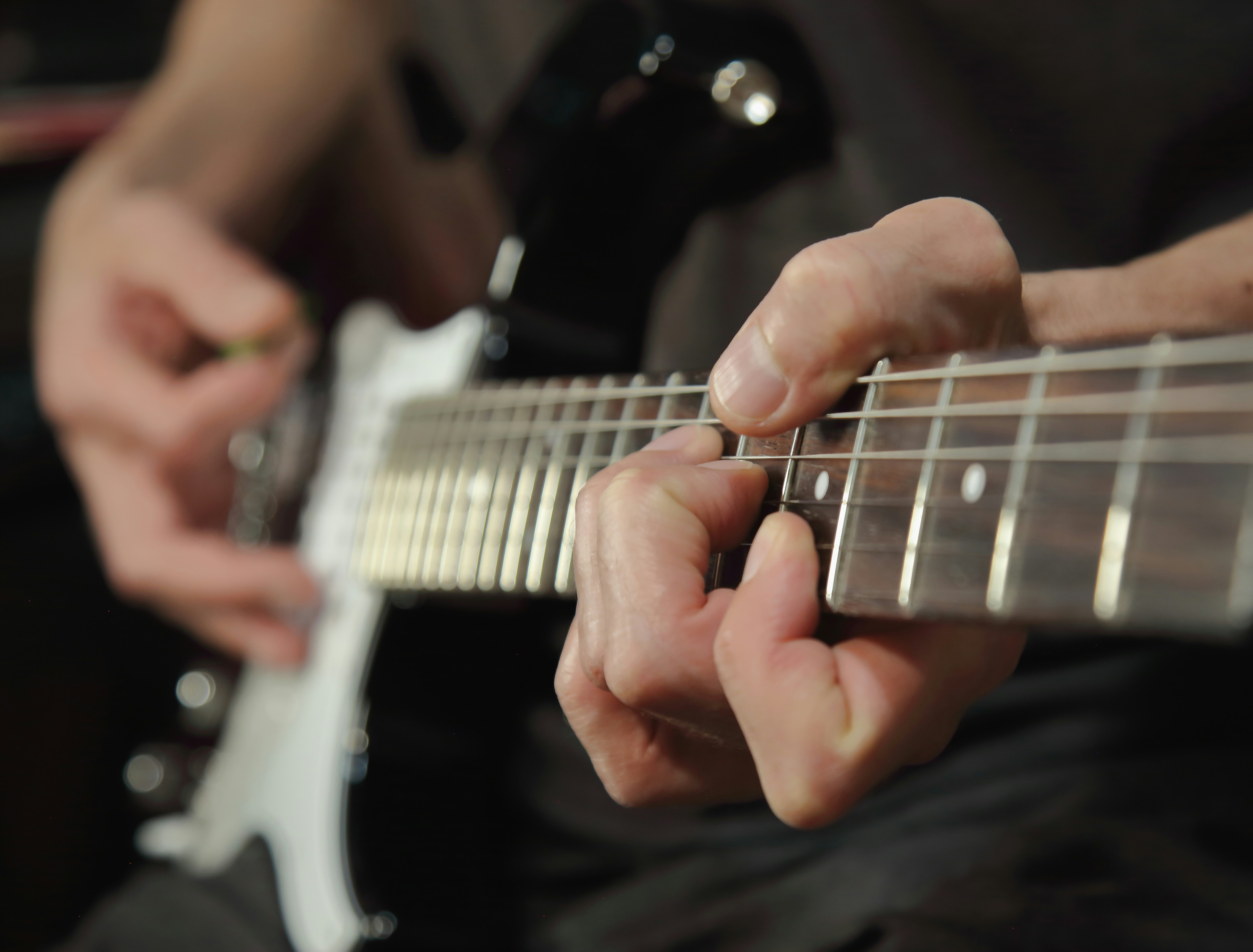 Hands in Focus: The Guitarist's Precision on the Neck