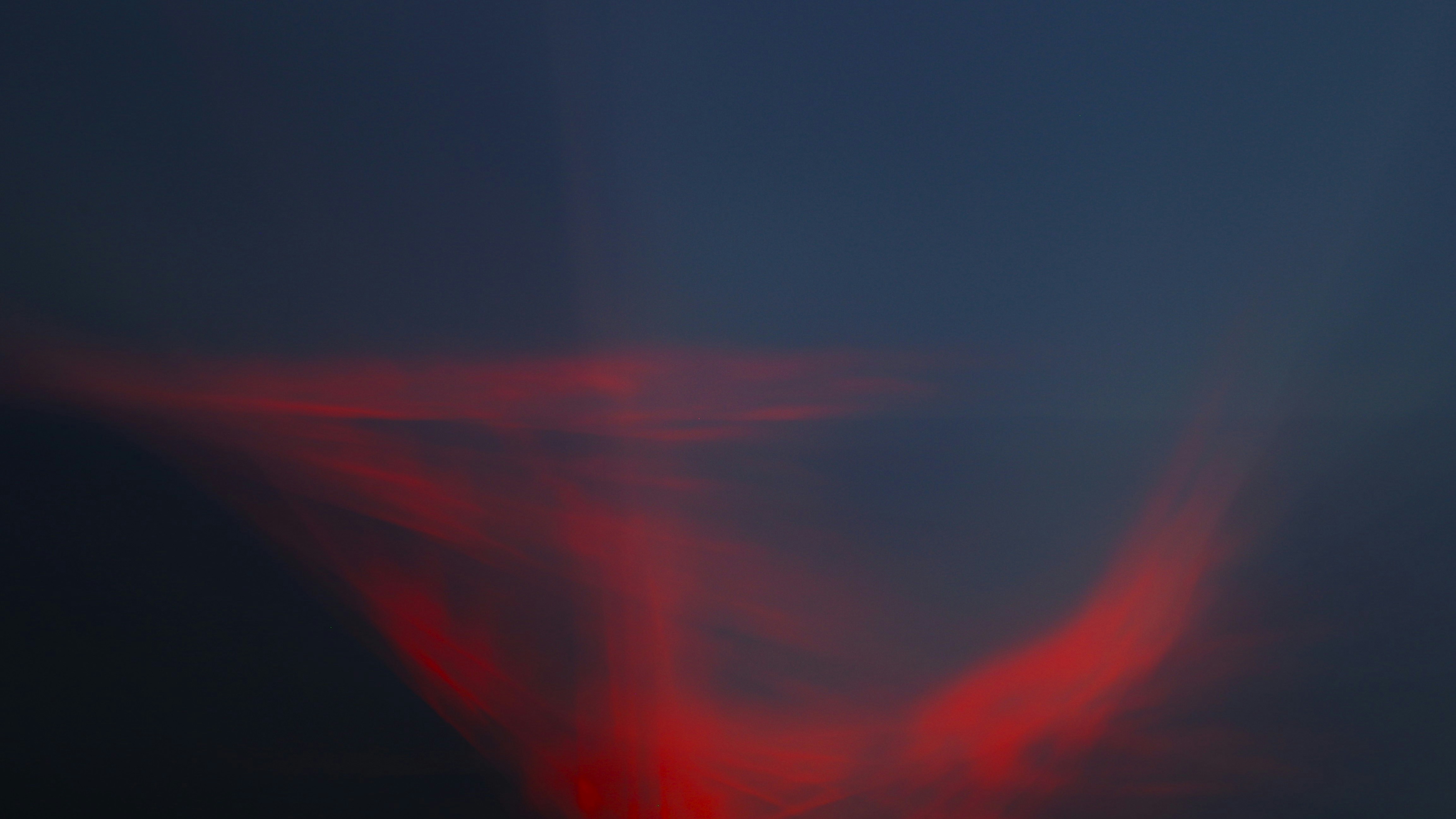 Ember Veil at Dusk: Red Clouds Against Quiet Night
