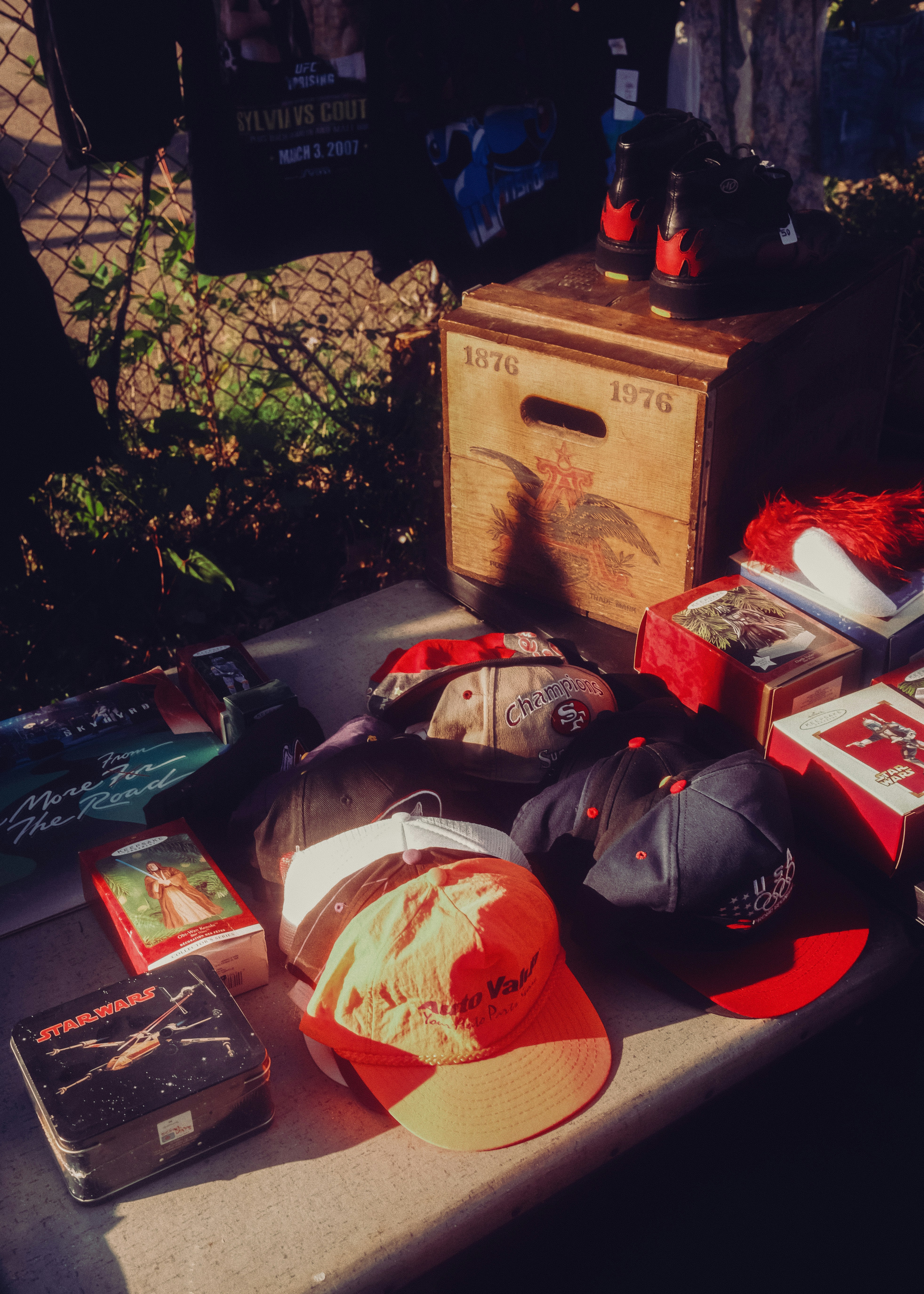 Sunlit Gear and Memorabilia Spread on a Shadowed Table