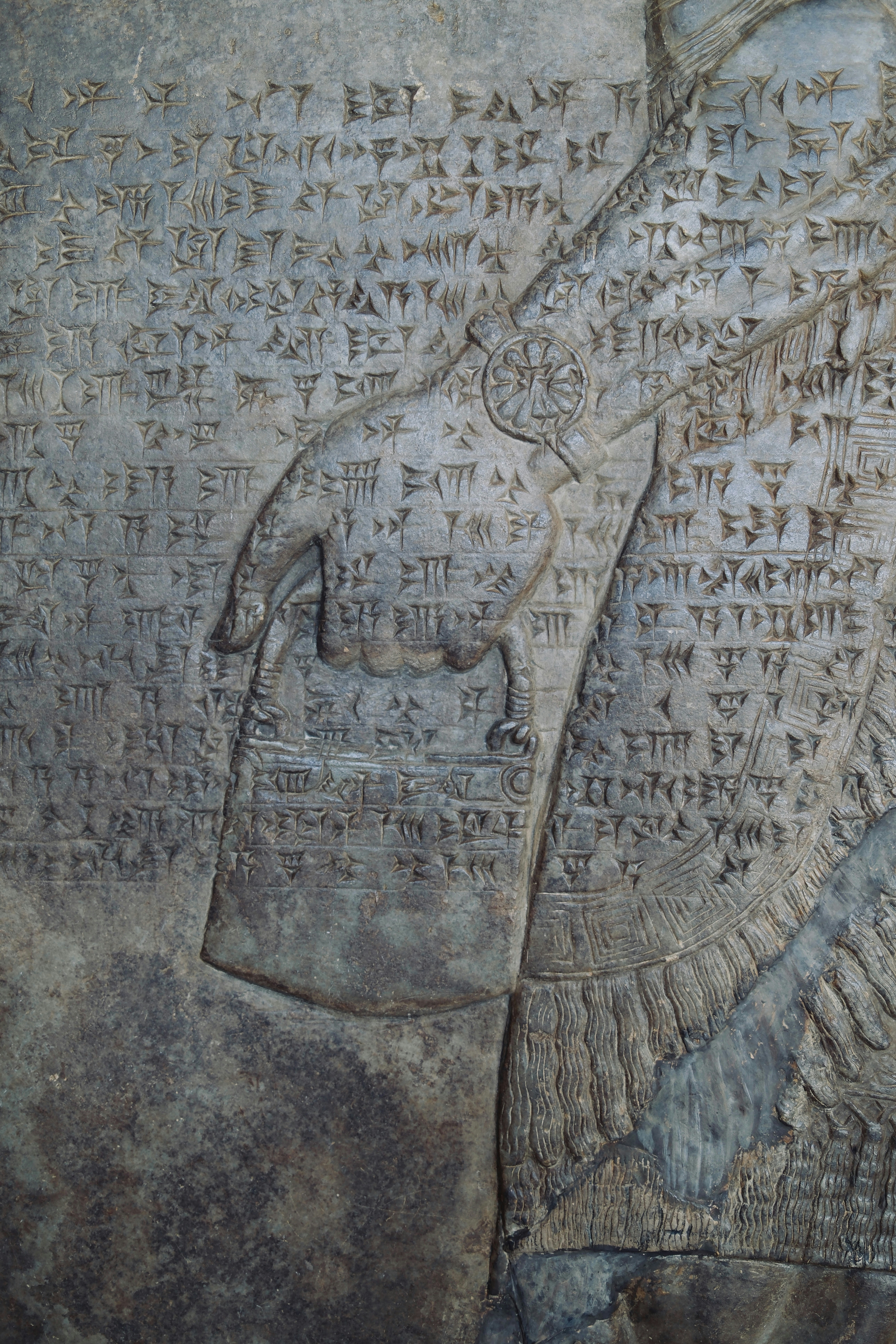 Stone Hand of Authority: A Carved Figure Grasping a Rod