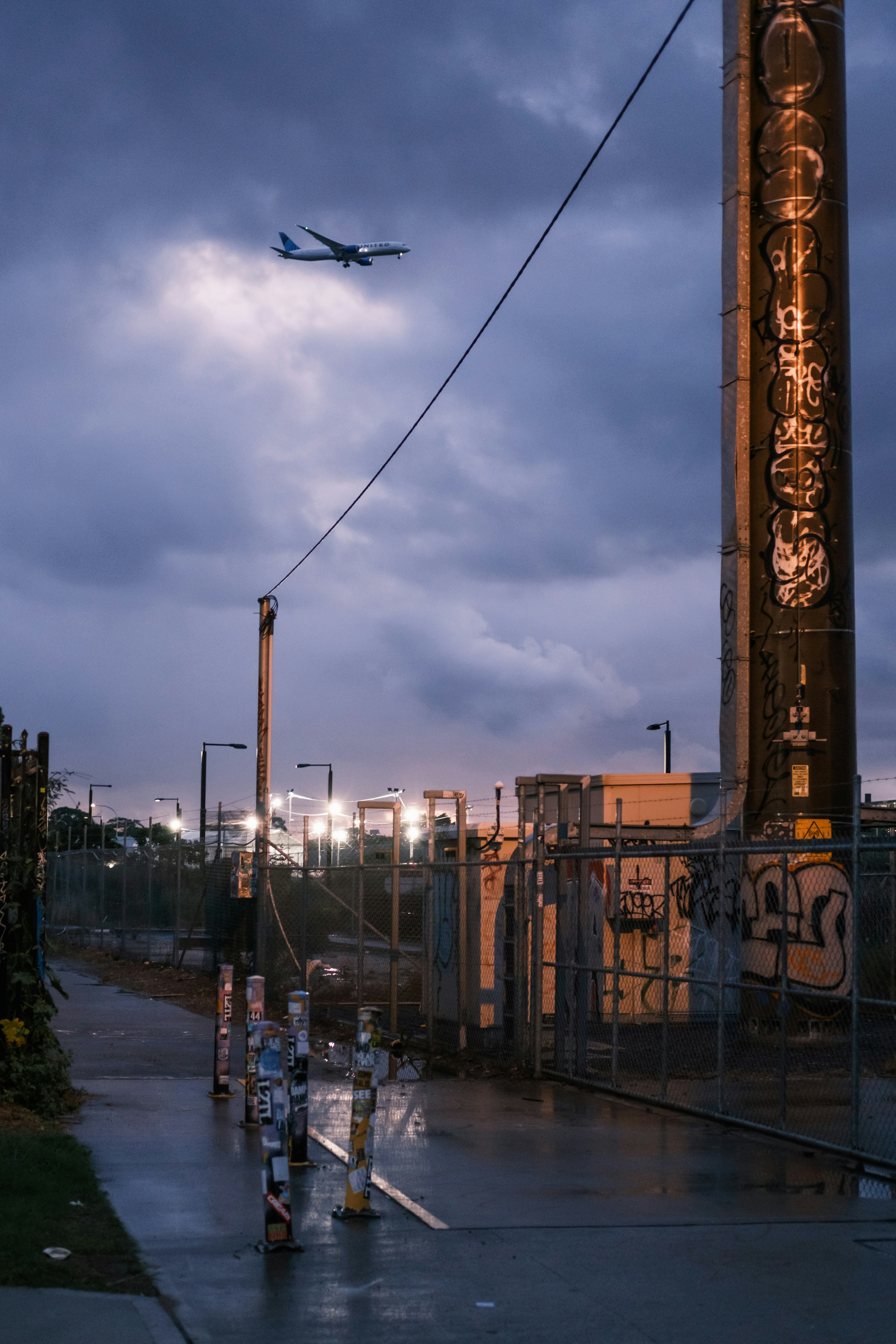 Vanguard of Dusk: Plane Crossing an Urban Corrugated Horizon