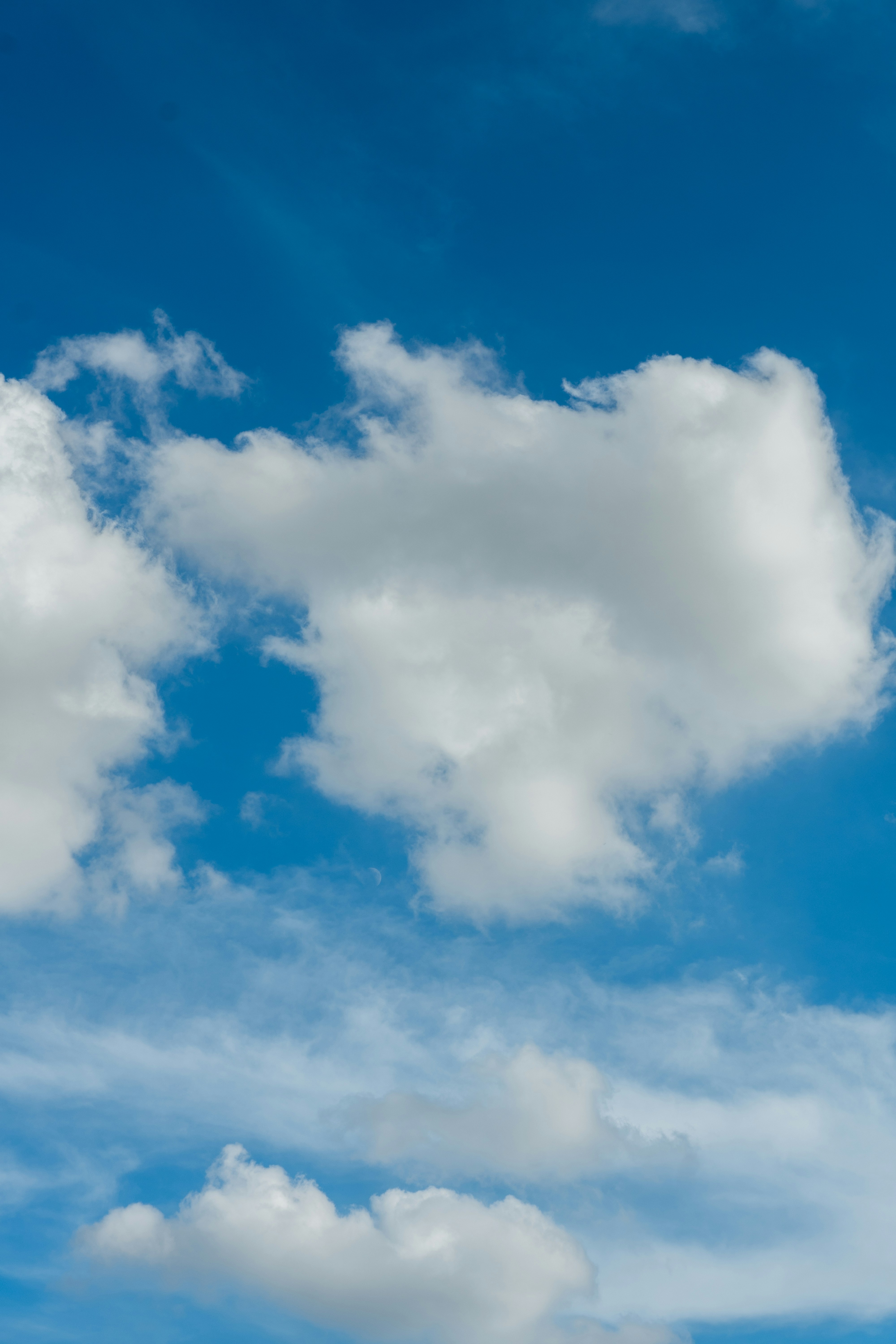 Azure Canvas: A Clean Patch of Sky with Cotton Clouds