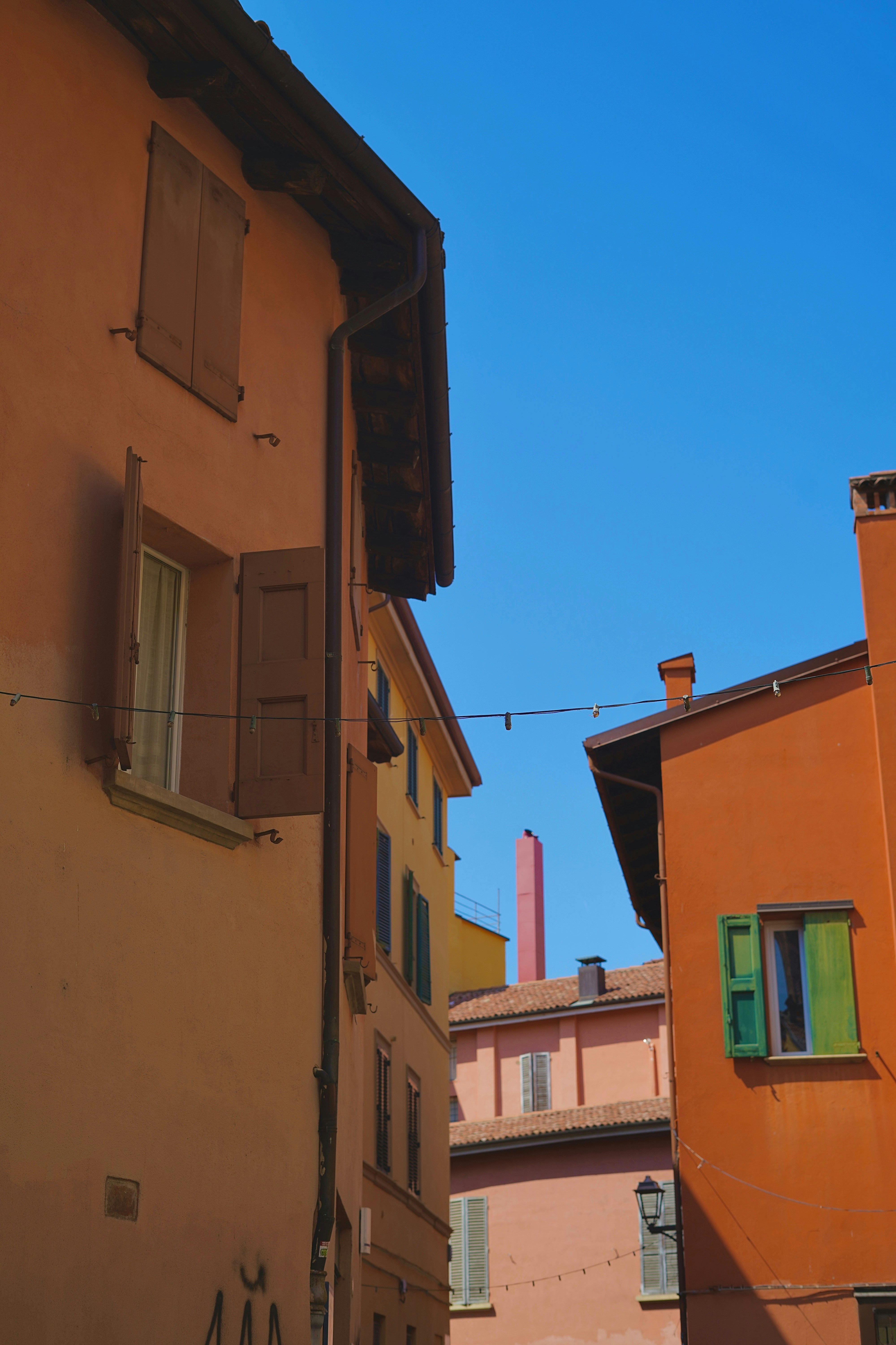 Sunlit Alley of Warm Facades