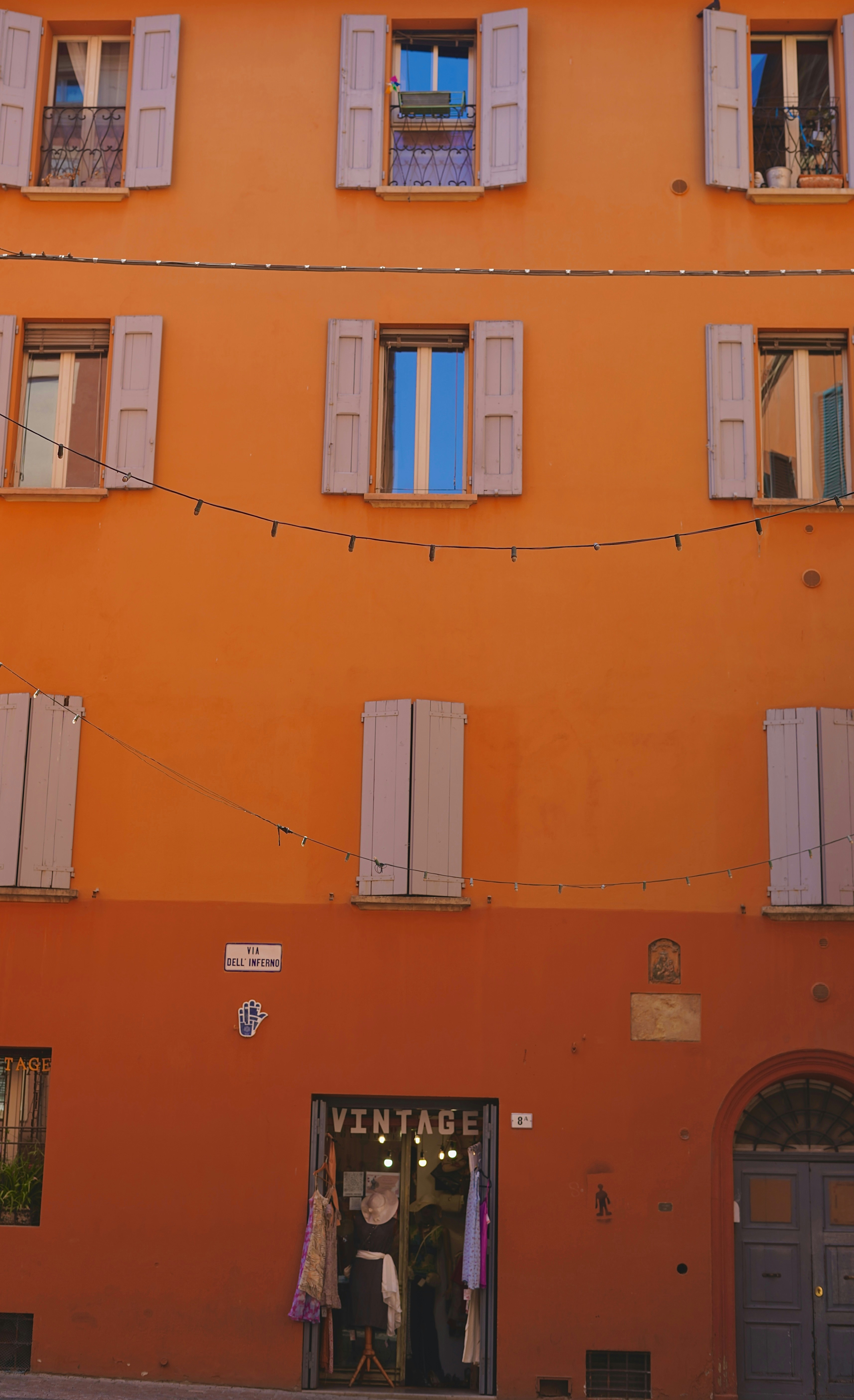 Sunlit Orange Facade with a Vintage Storefront