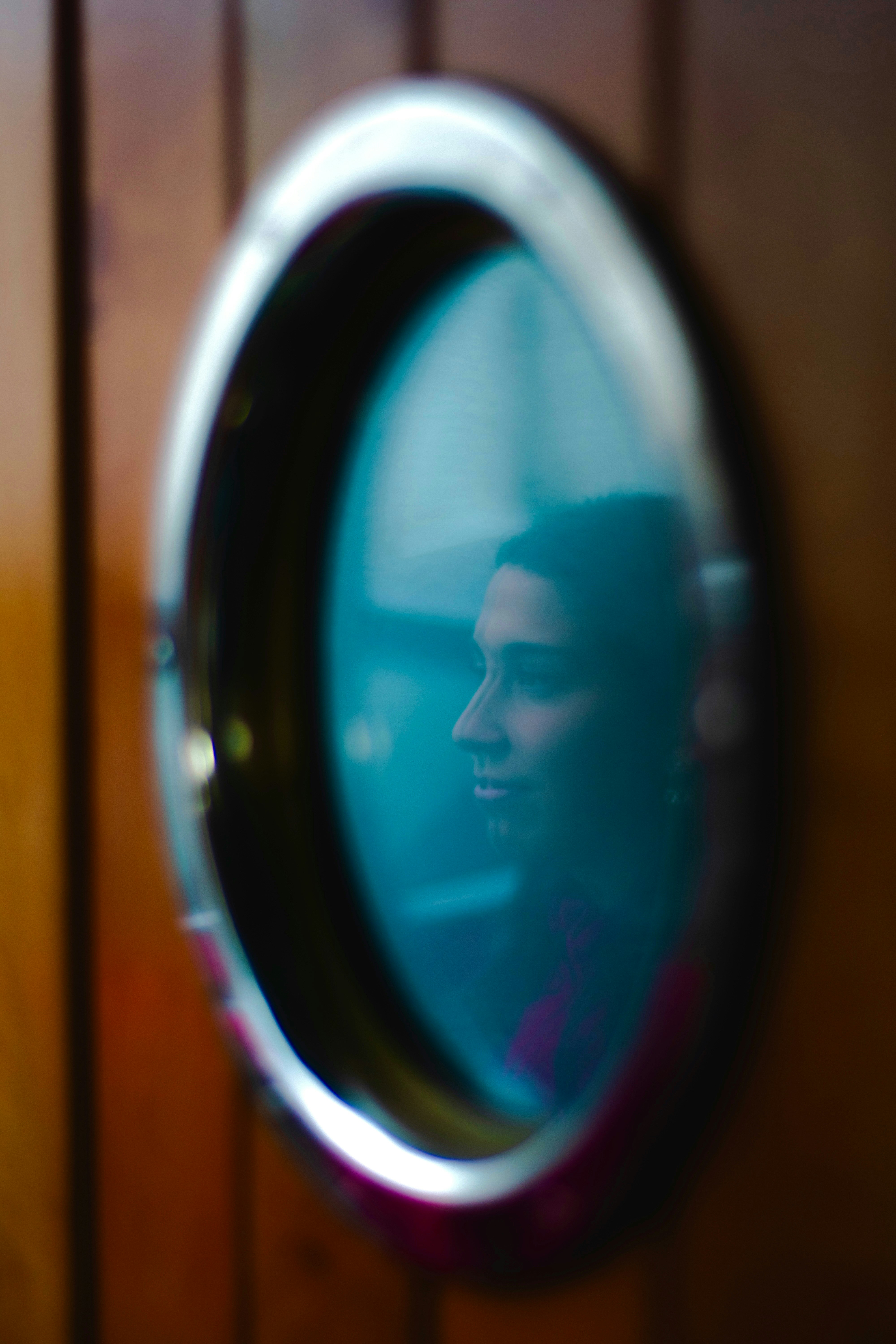 Reflected Portrait in a Tilted Round Mirror