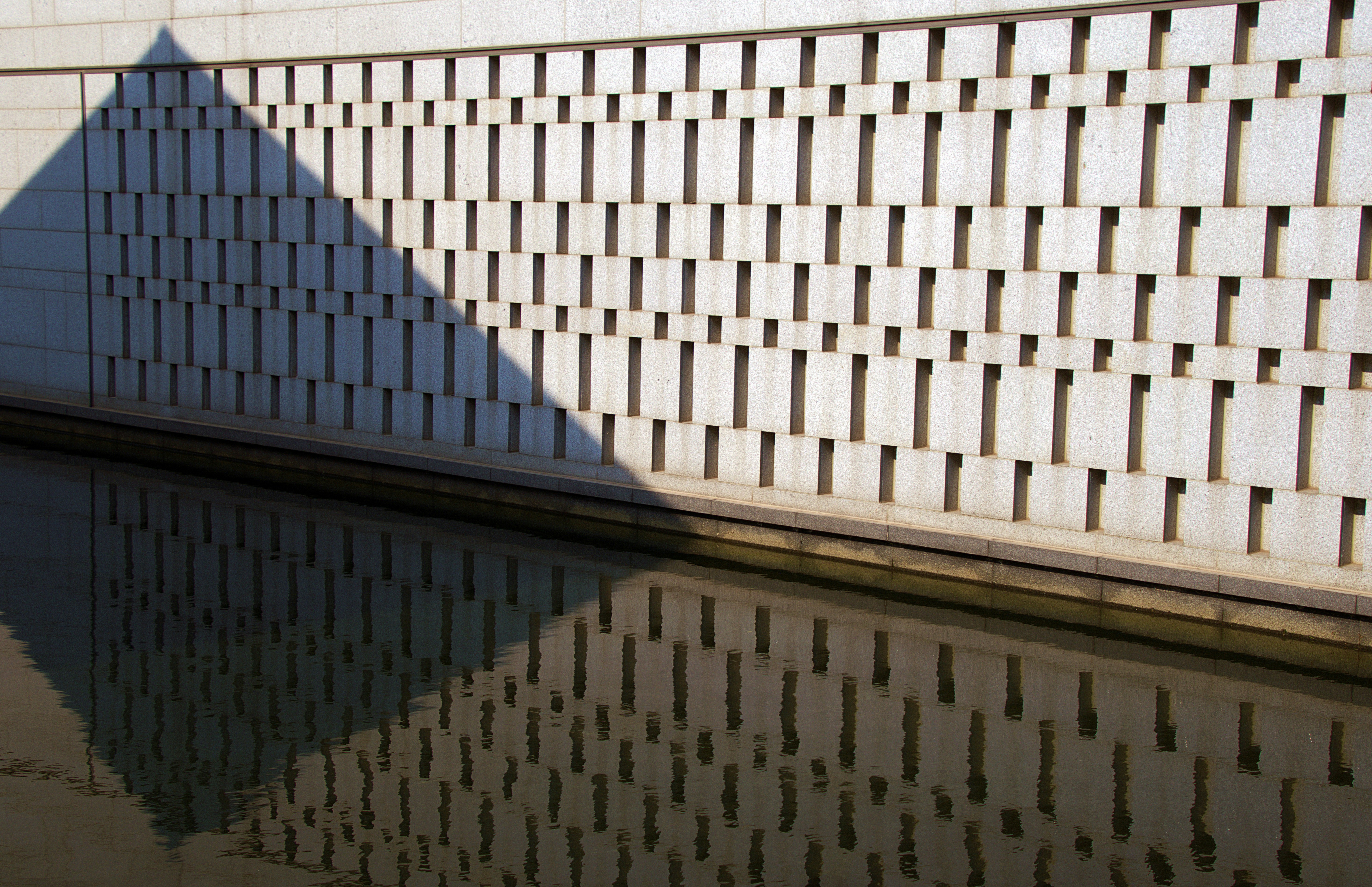 Shadowed Facade Overlapping with Reflected Pattern