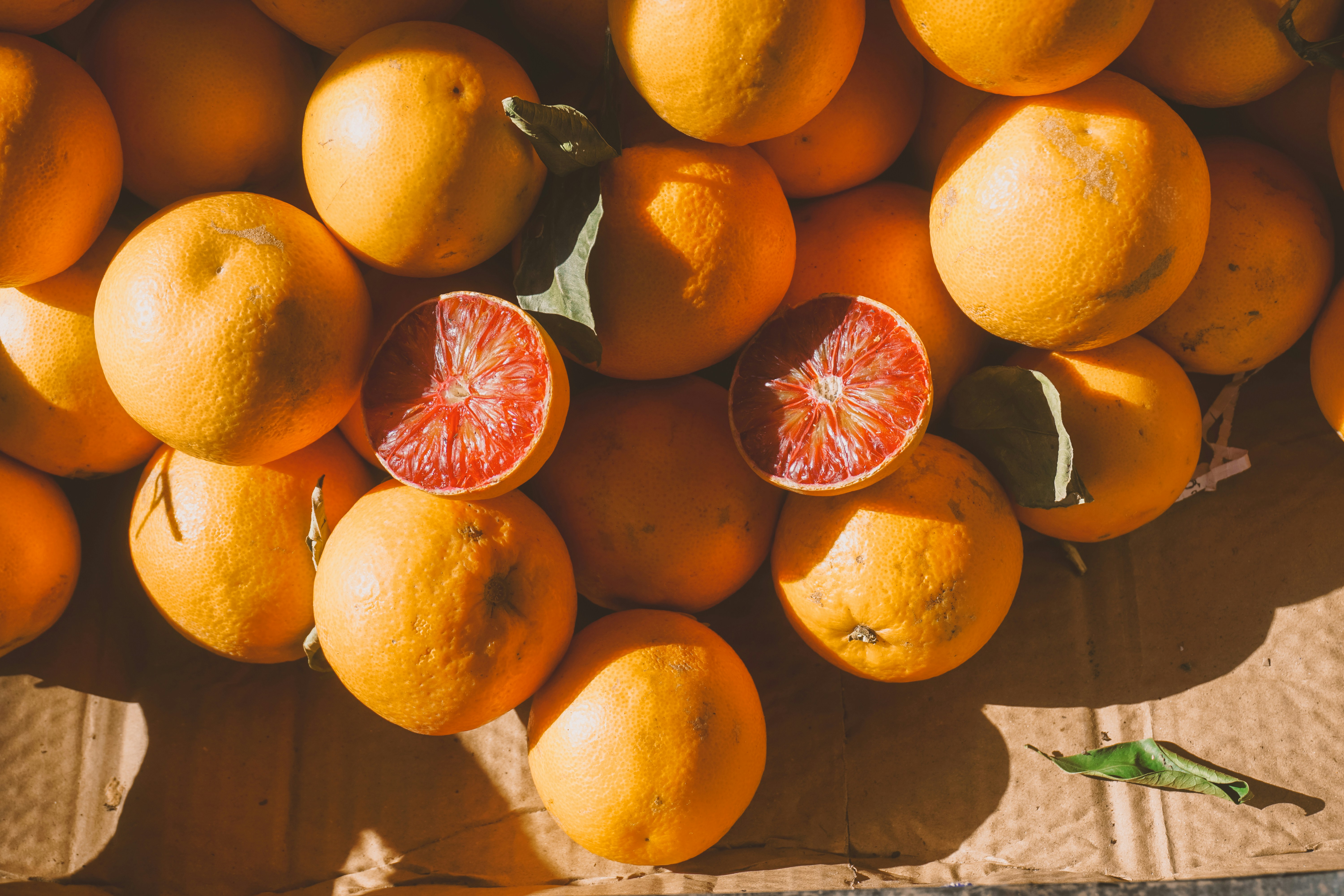 Broken-Open Cardboard Basket of Citrus