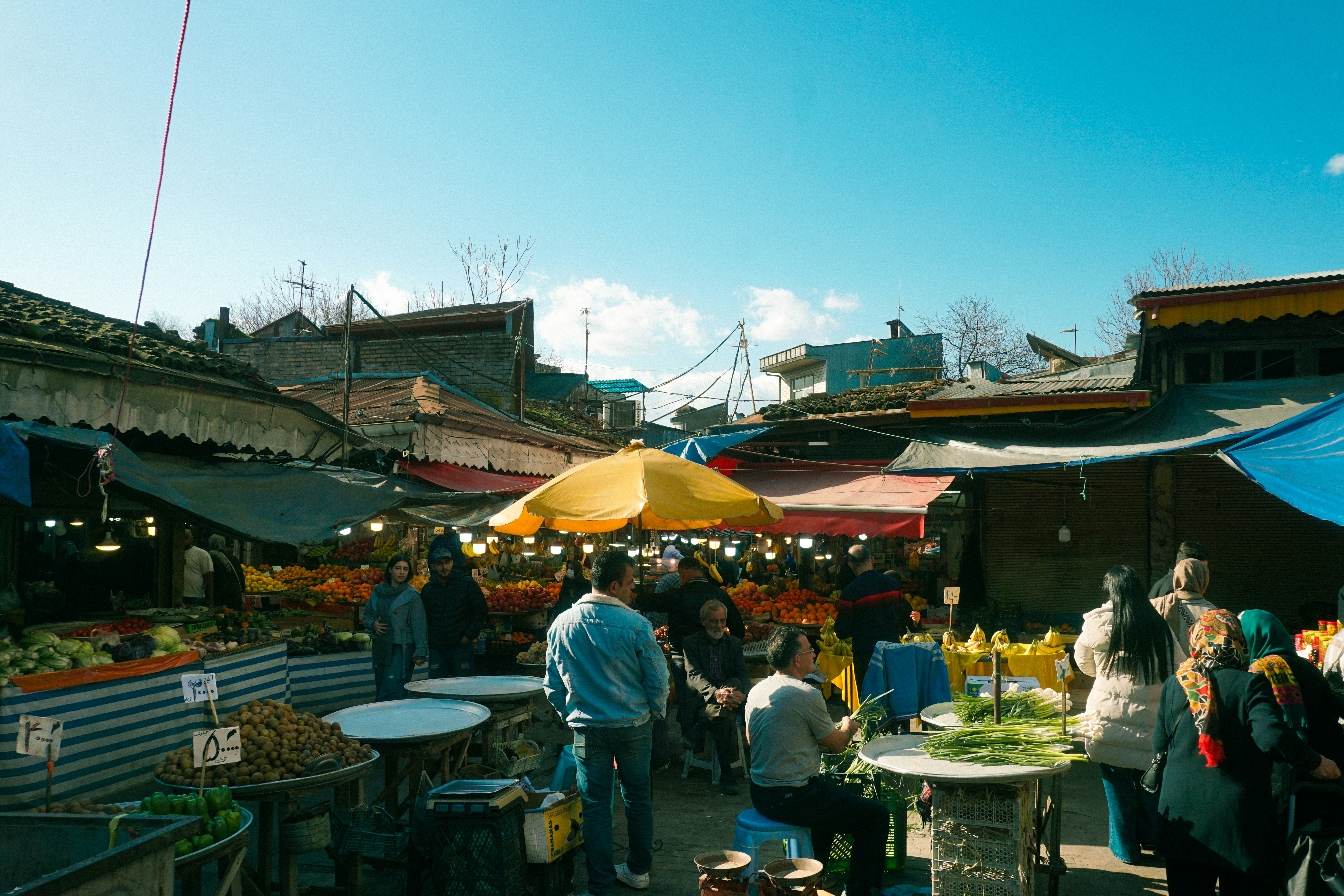 Market Pulse Under Colorful Umbrellas