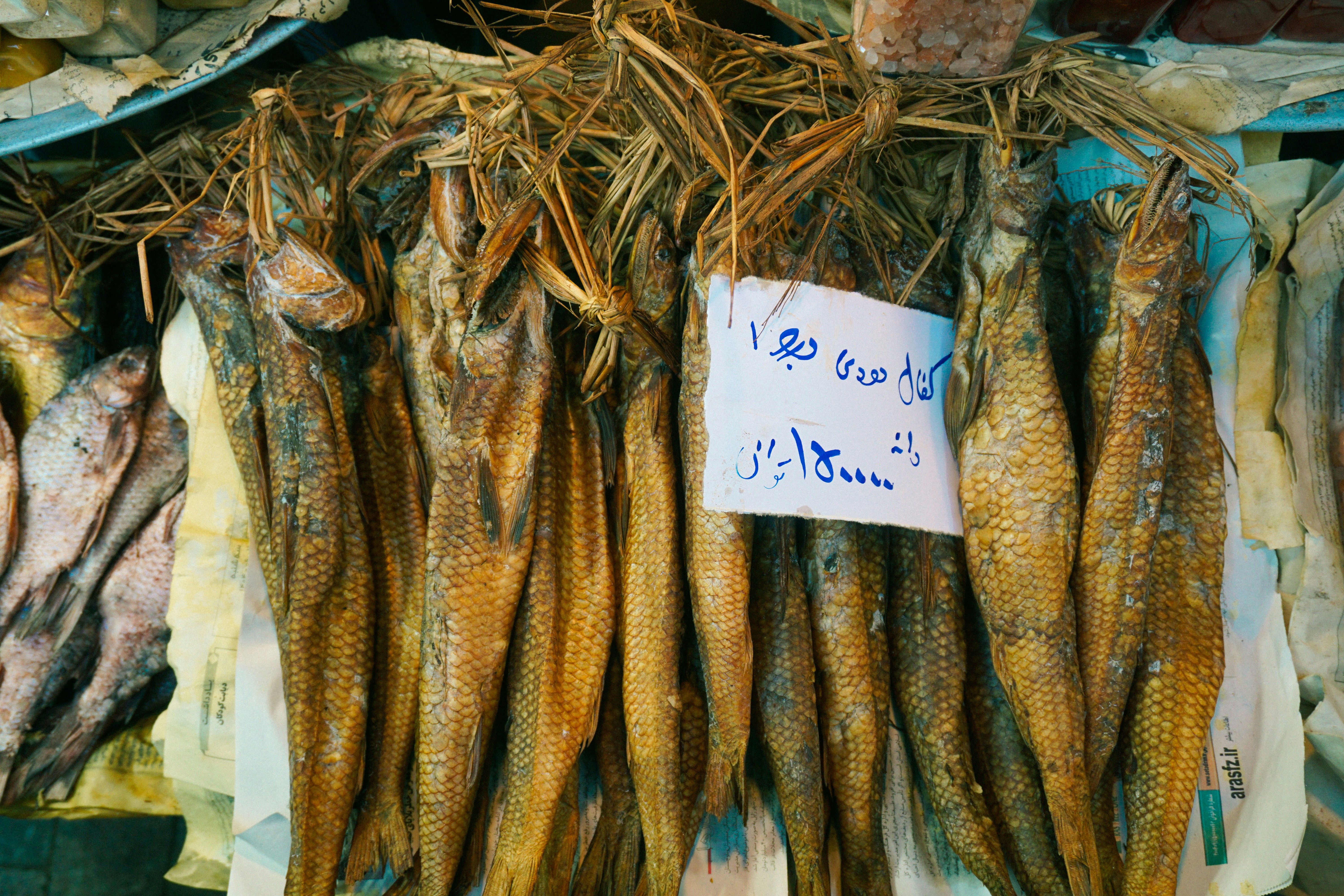 Amber-cured Hangs: Row of Golden Dried Fish at a Market Stall