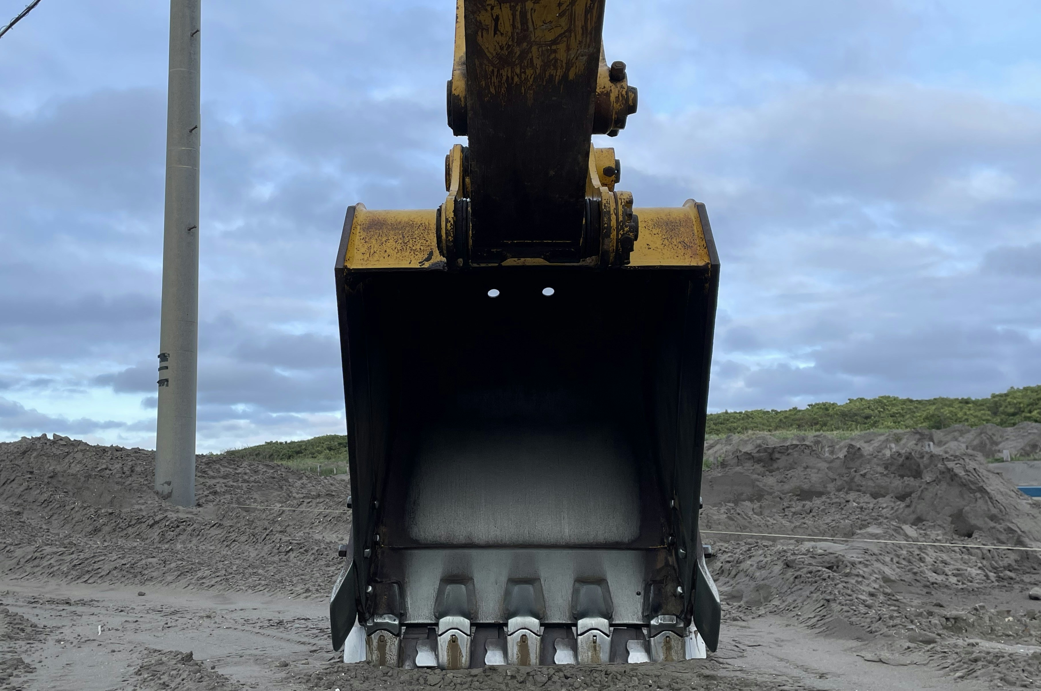 Front View of a Heavy Excavator Bucket Ready for Digging