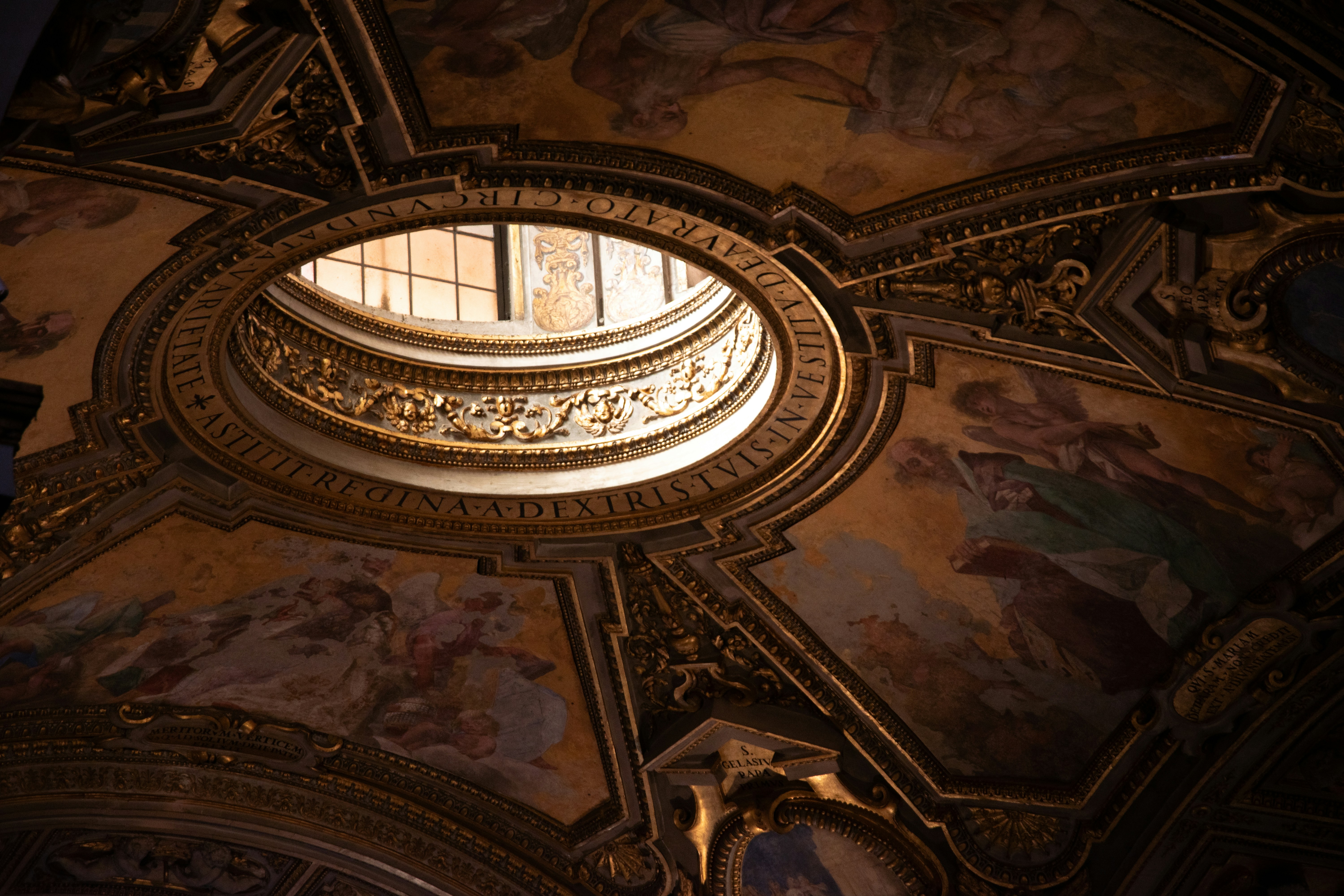 Oculus of Light: An Ornate Baroque Ceiling Framed by an Illuminated Ring