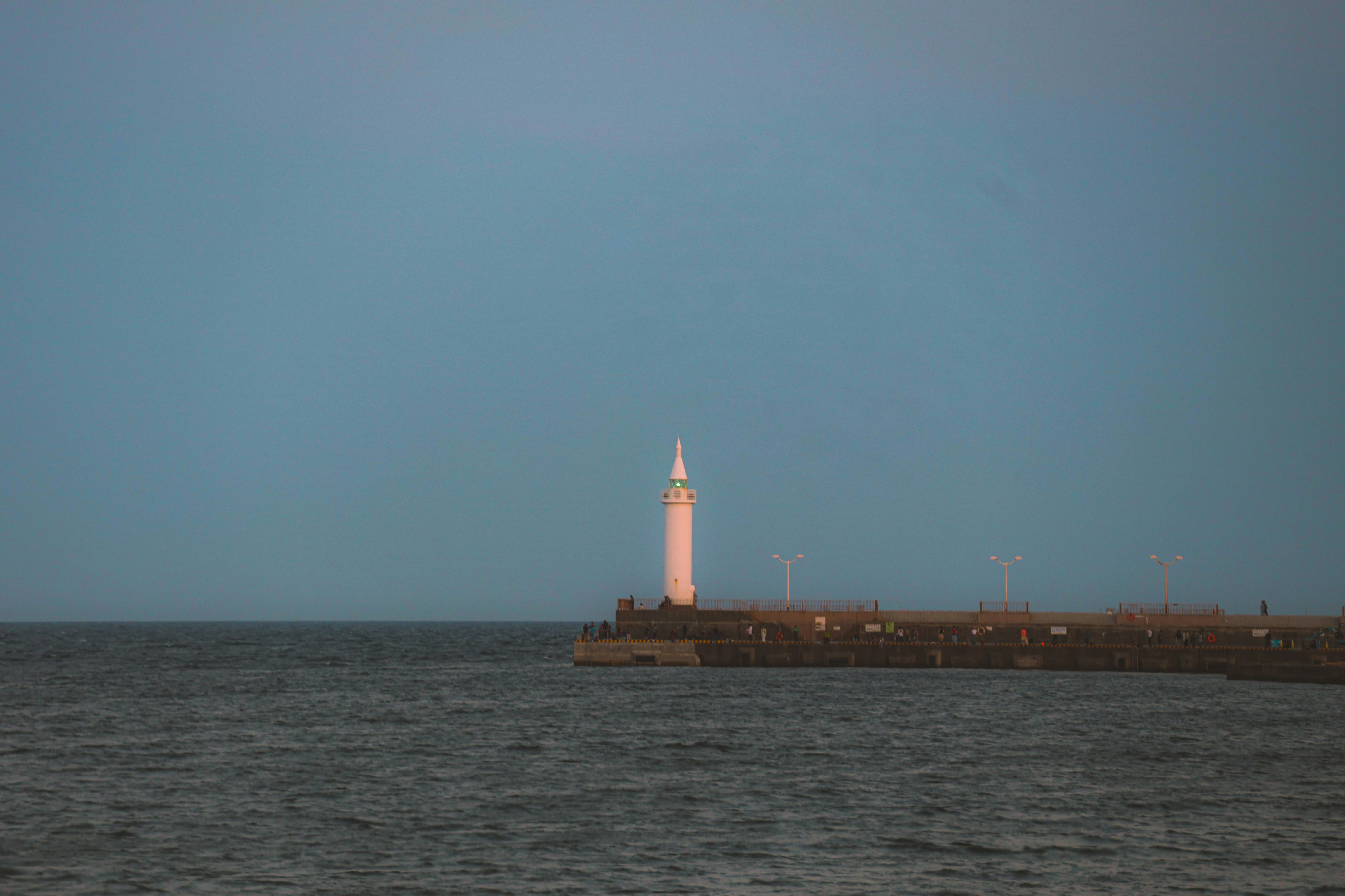 Beacon on the Horizon: A Solitary Lighthouse at Sea