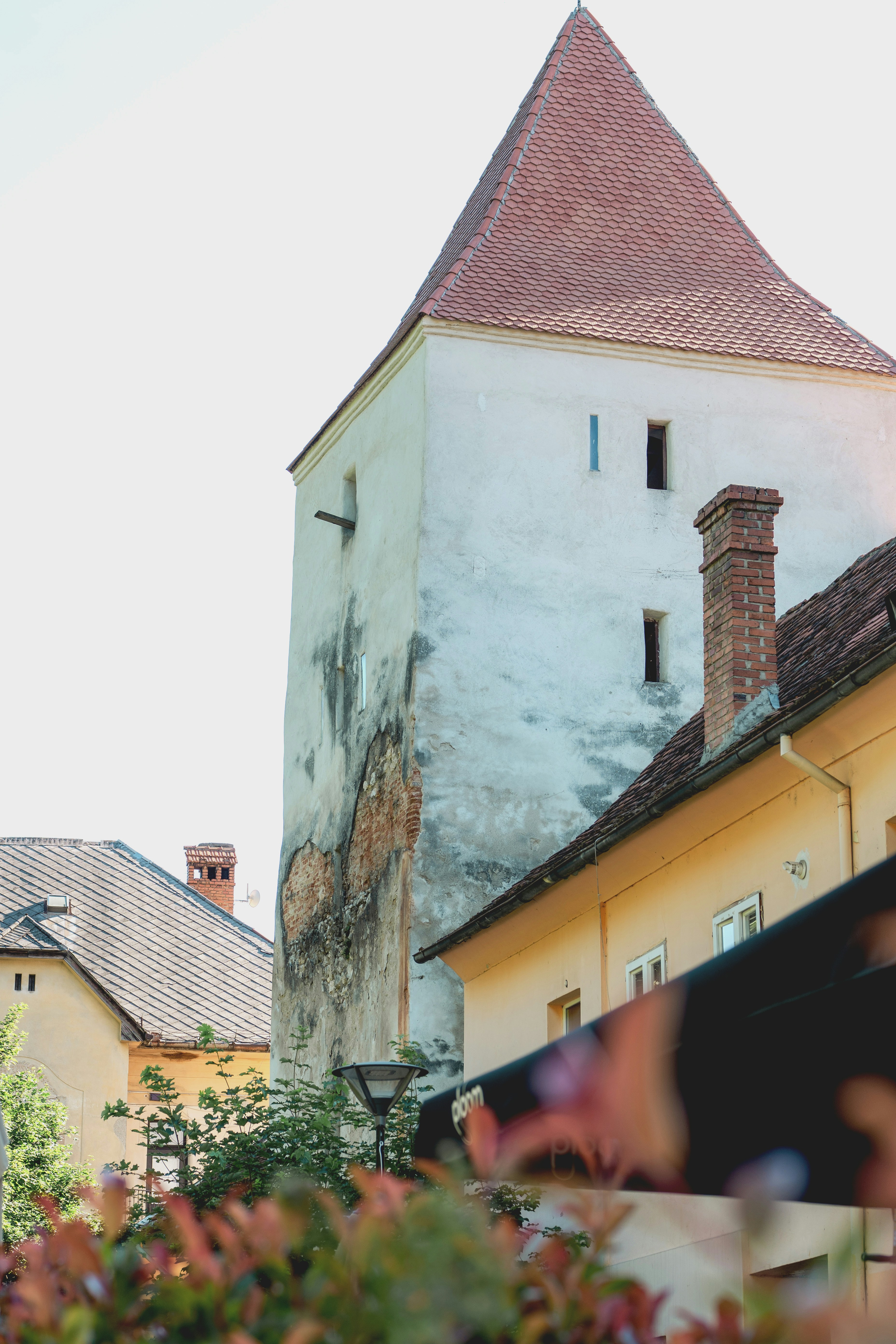 Towering Turrets and Sunlit Facades in a Cozy European Street