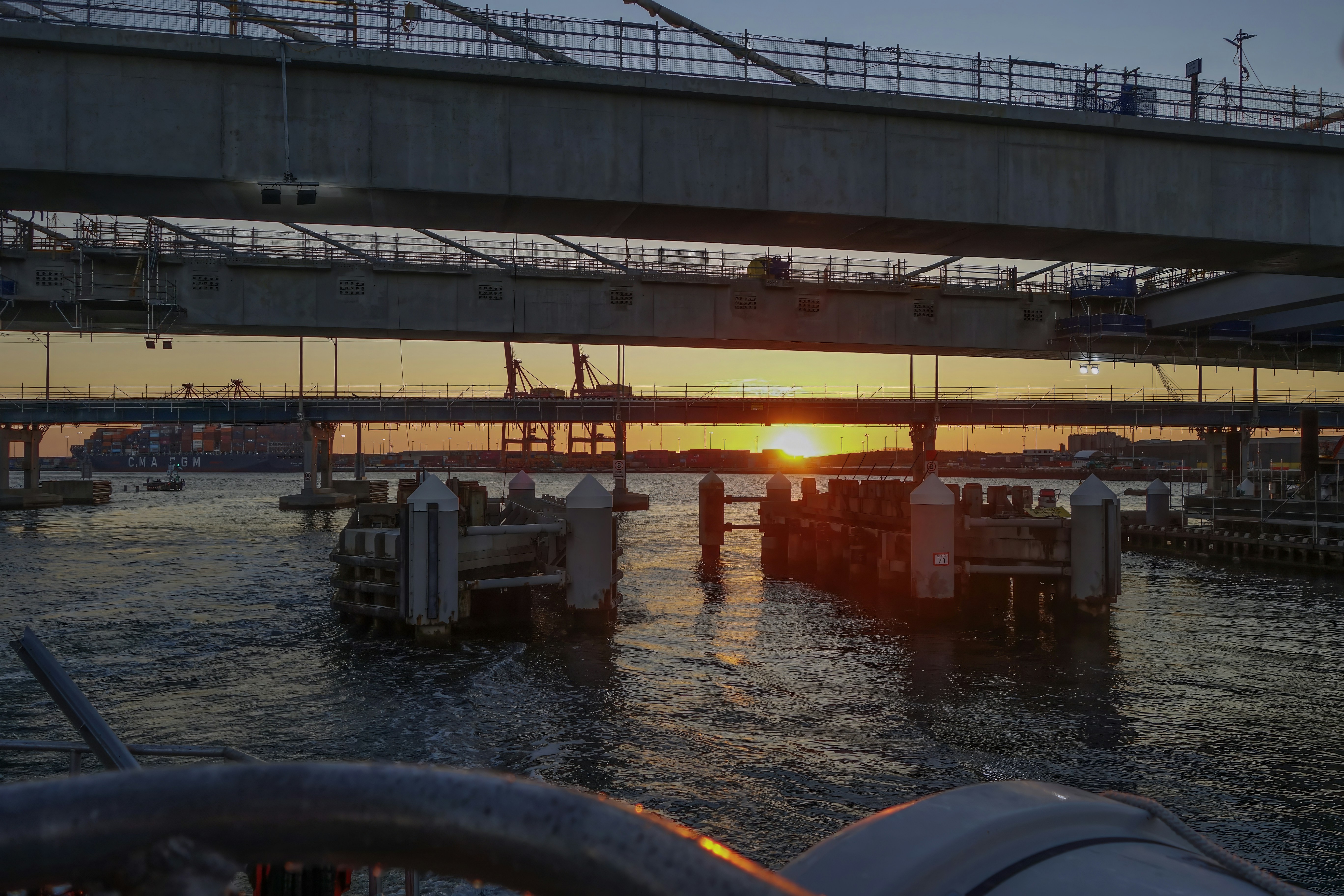 Sunset Transit over the Marina: Bridges Framing a Golden Moment