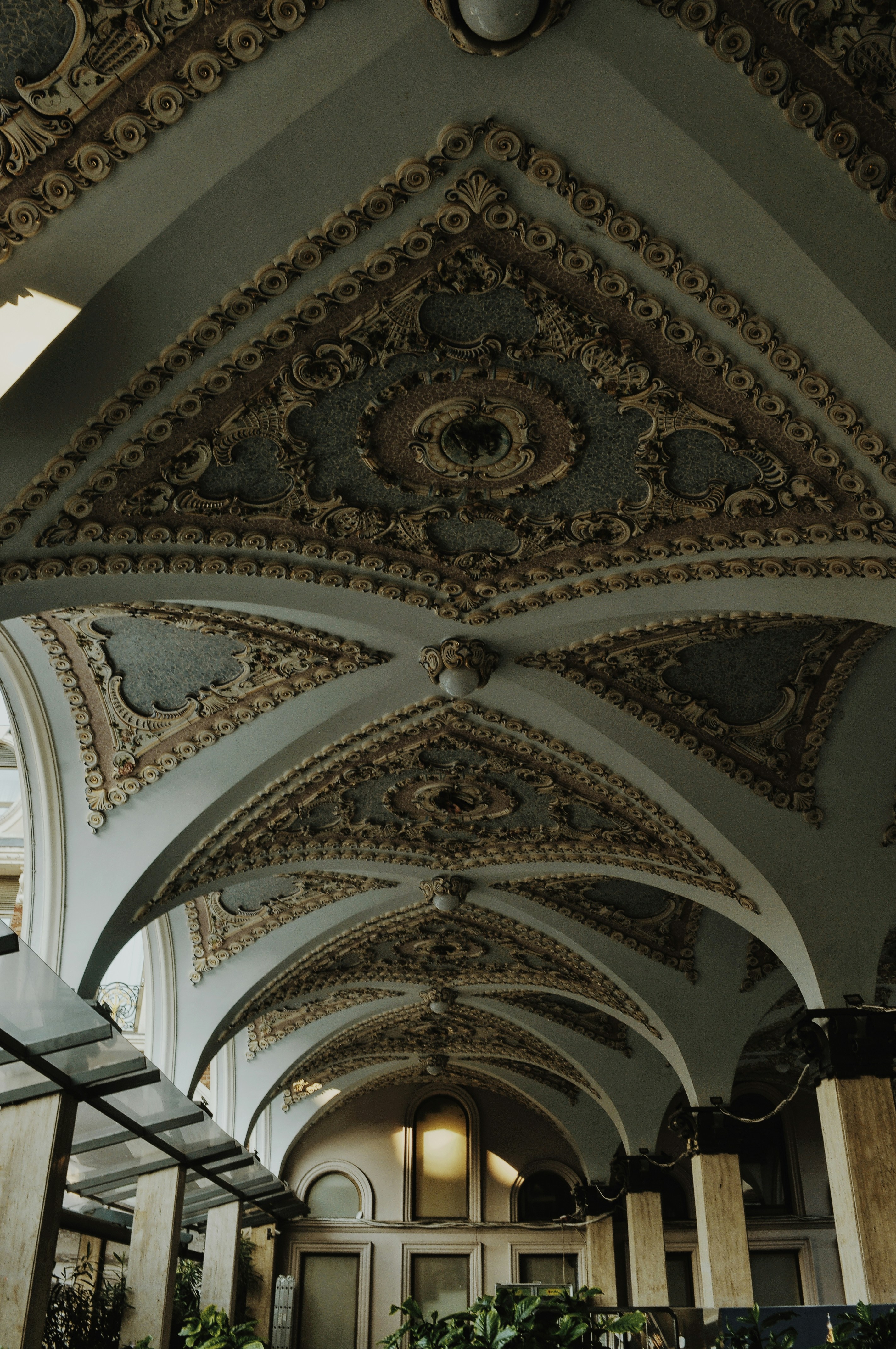 Vaulted Ornamentation: Carved Ceilings and Arched Passage in a Historic Corridor