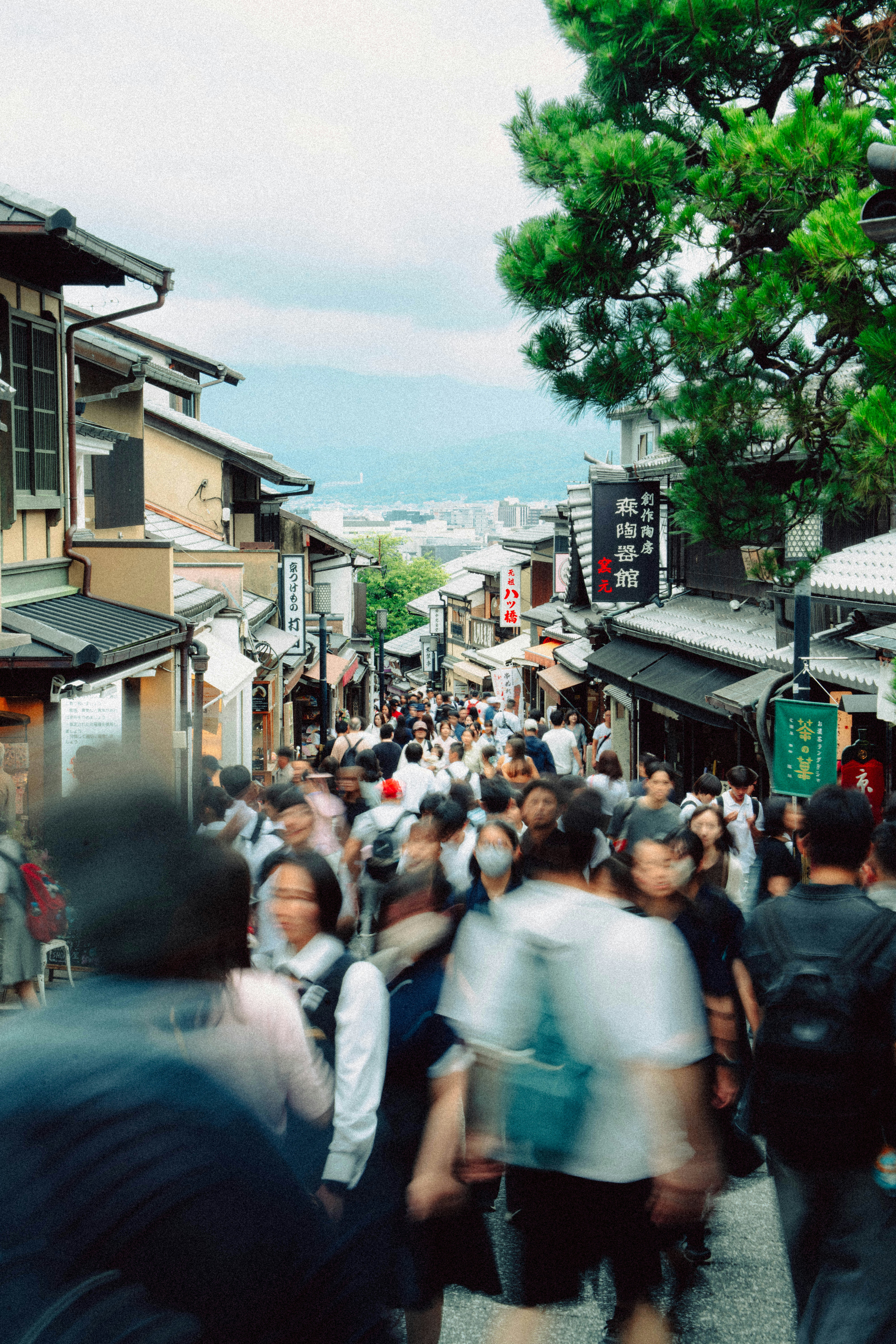 Crowded Noodle Street: A Densely Packed Heritage Row in Motion