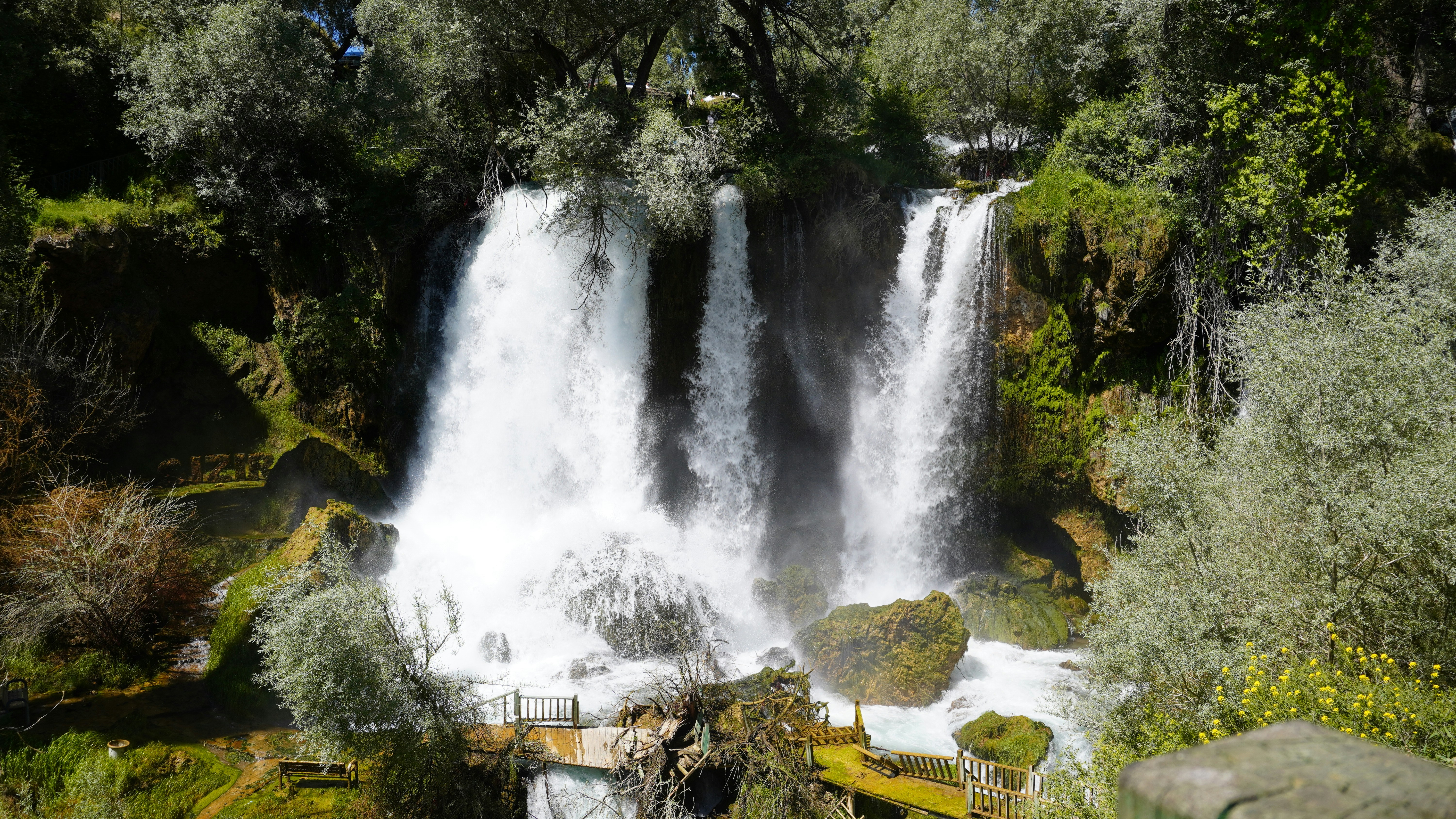 Whispering Falls: A Quiet Cascade Surrounded by Green and Stone