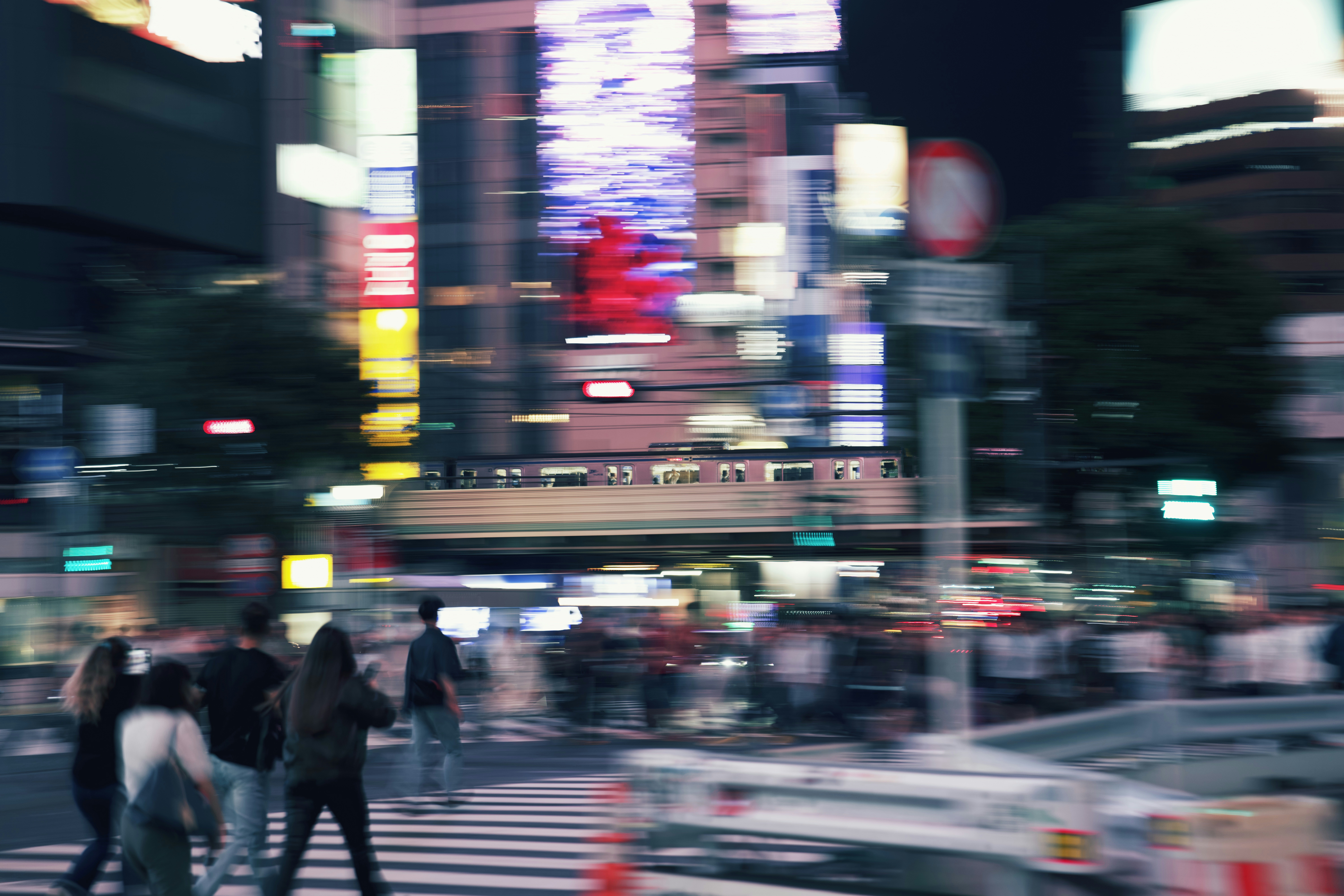Neon Nightfall Shuffle at a Blurred Crosswalk