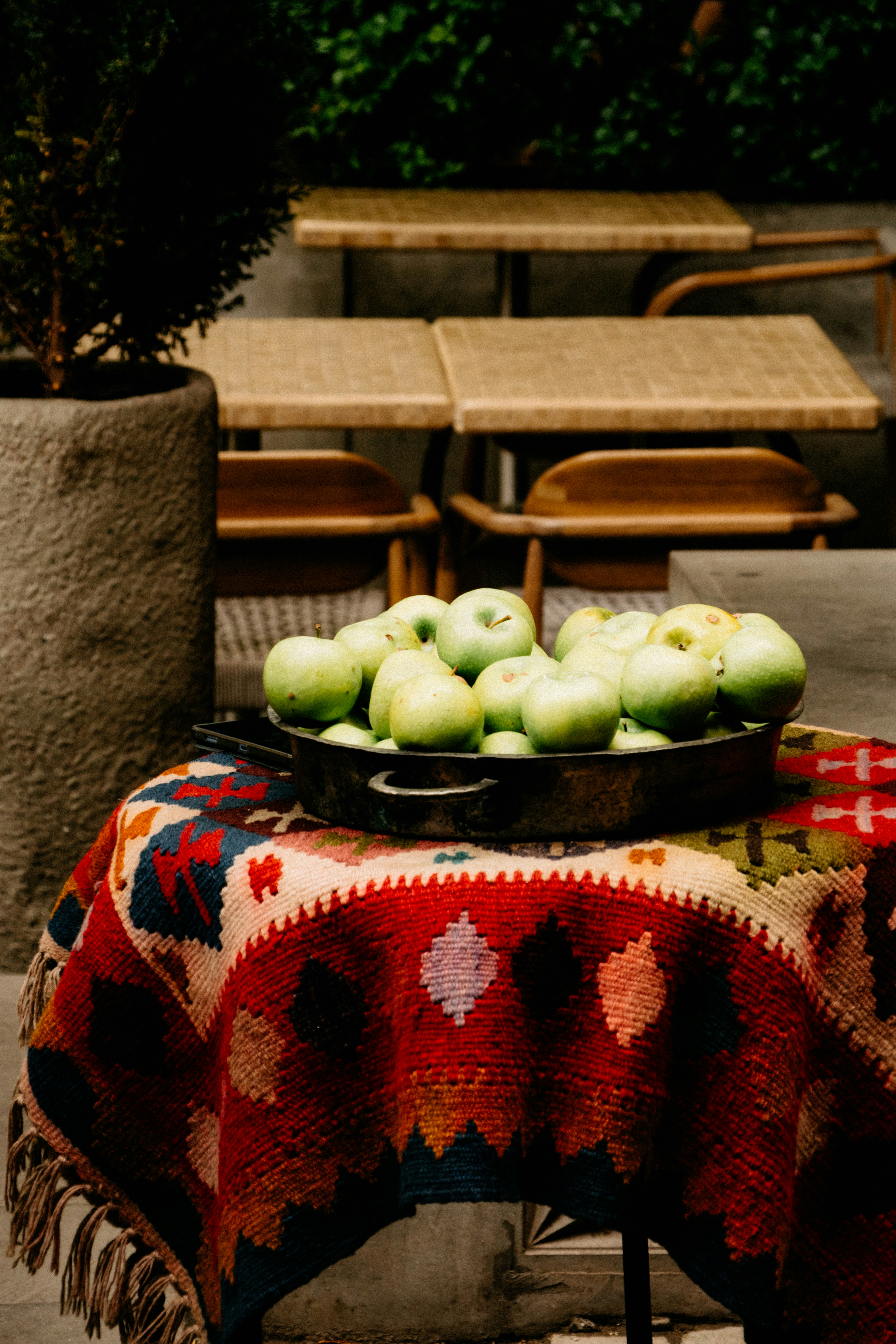 Green Apples on a Vintage Cloth aboard a Quiet Café Terrace