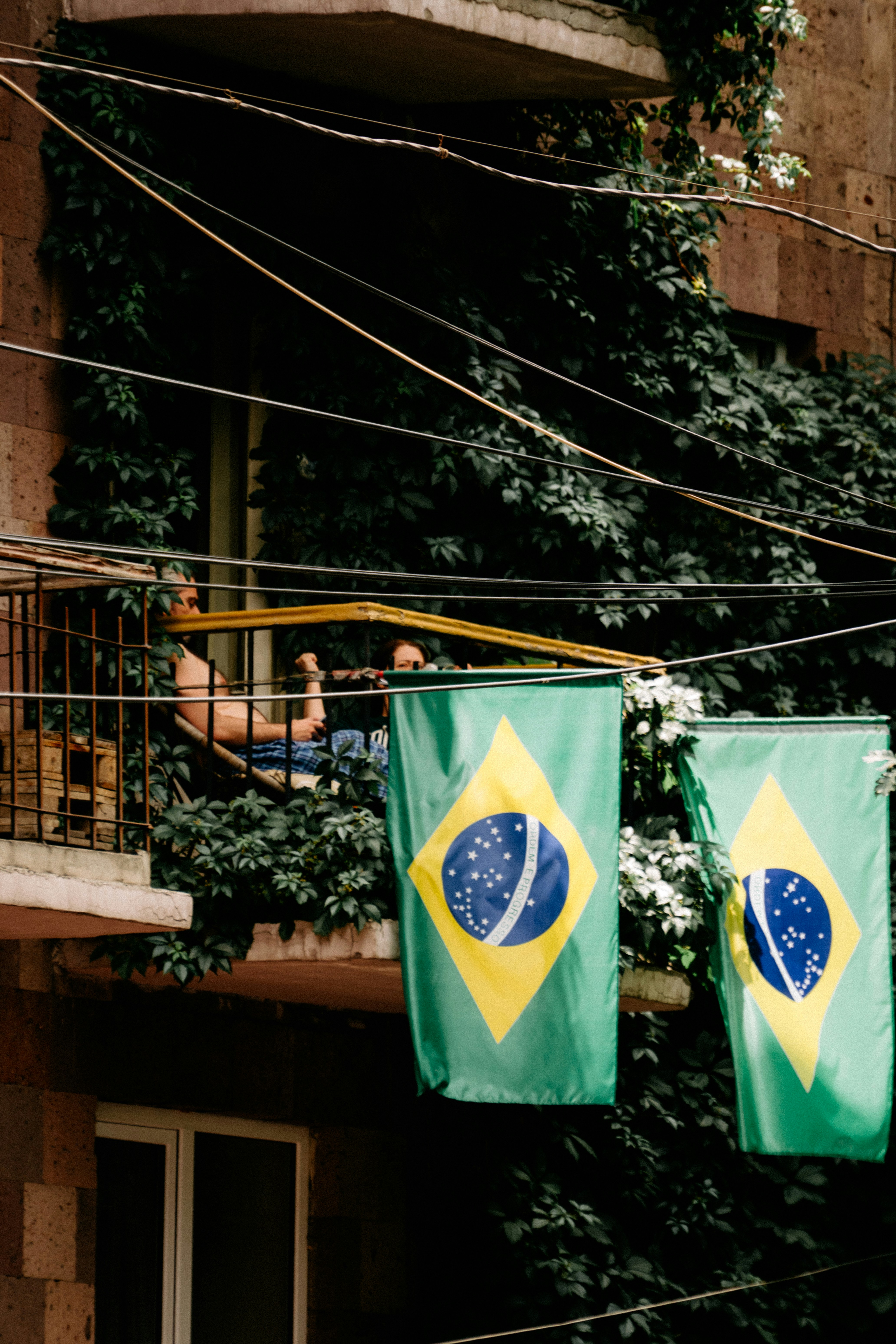 Brazilian Flags Over a Hidden Balcony