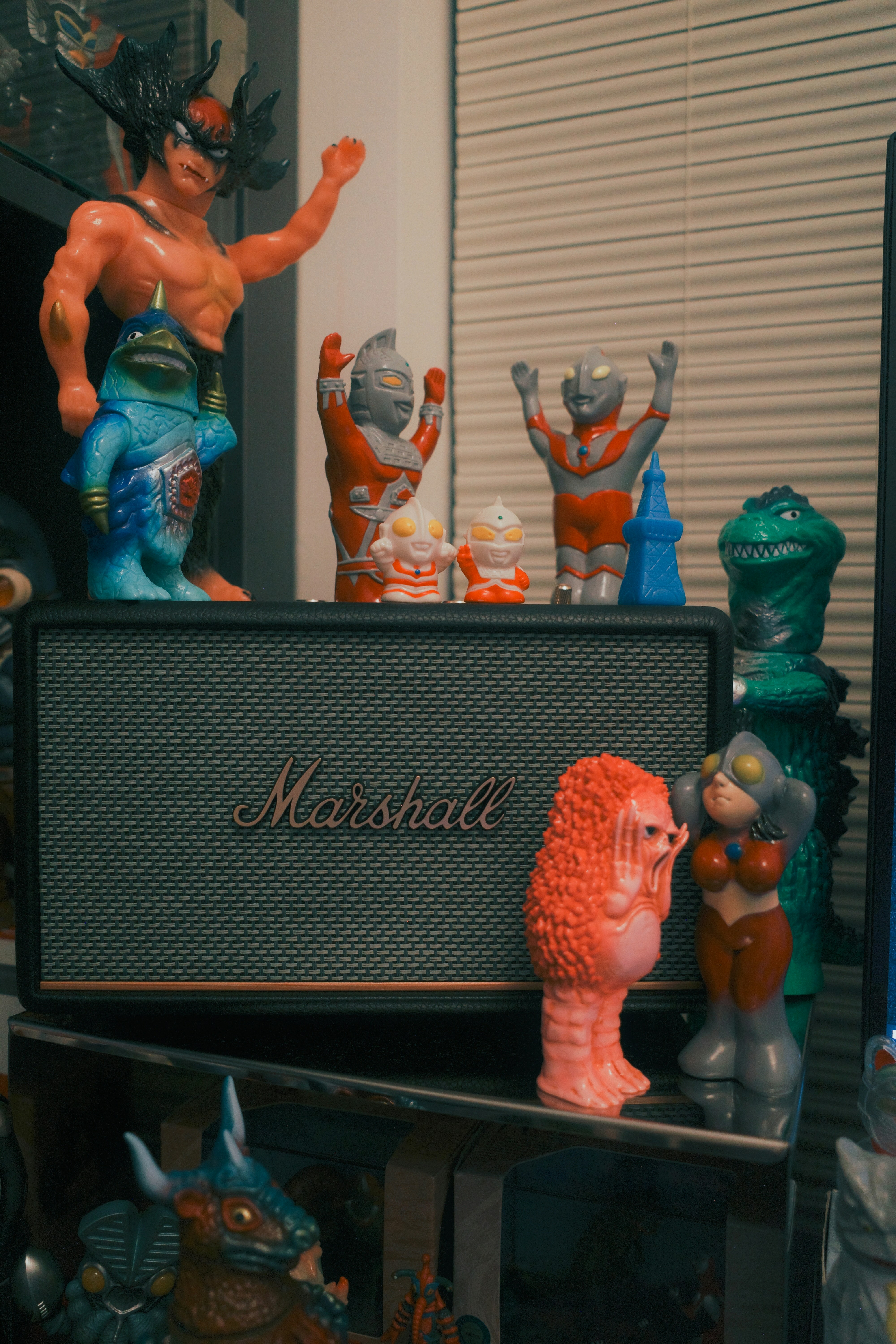Iconic toy lineup stacked around a vintage Marshall speaker