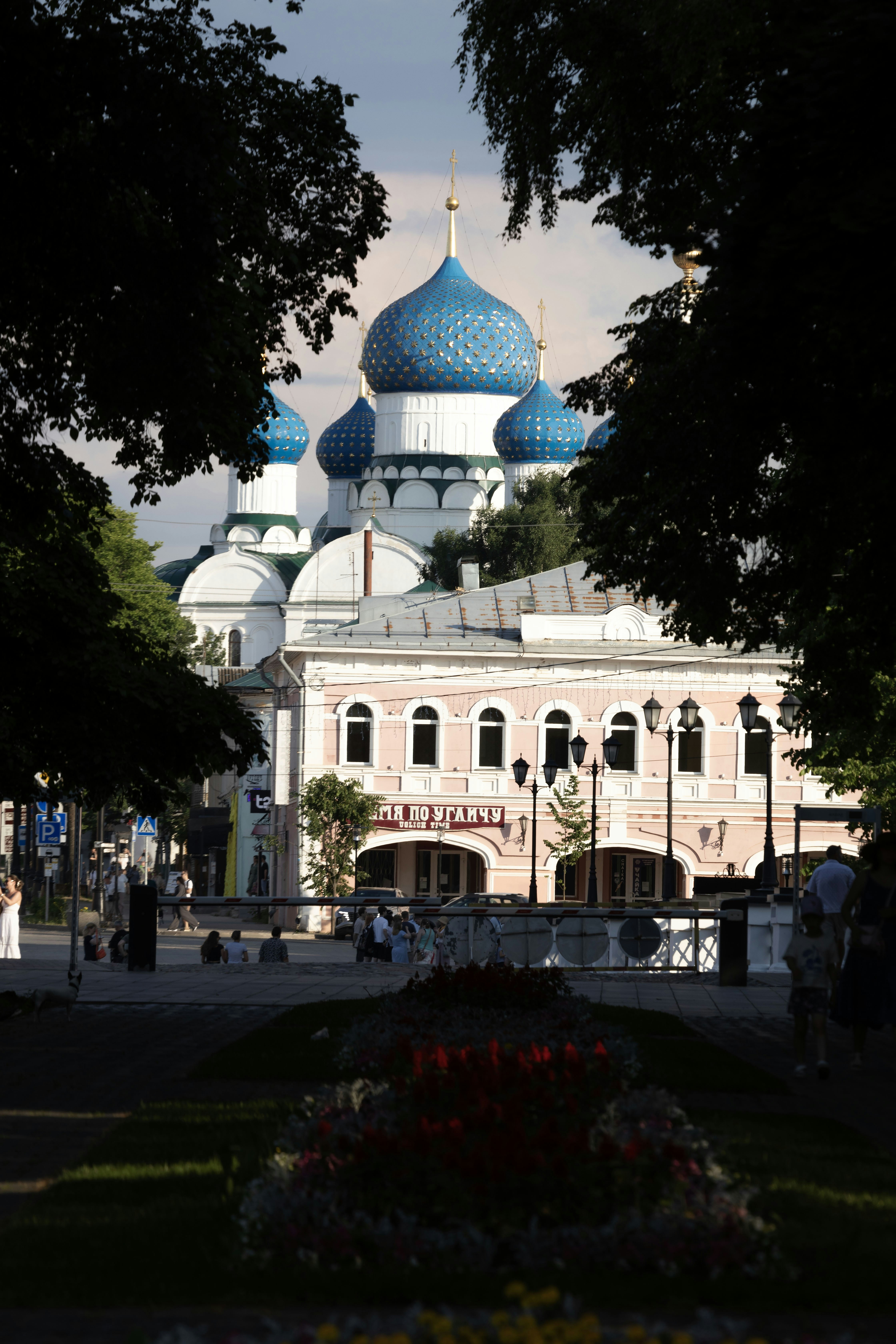 Blue Onion Domes Framed by Shadowed Archways
