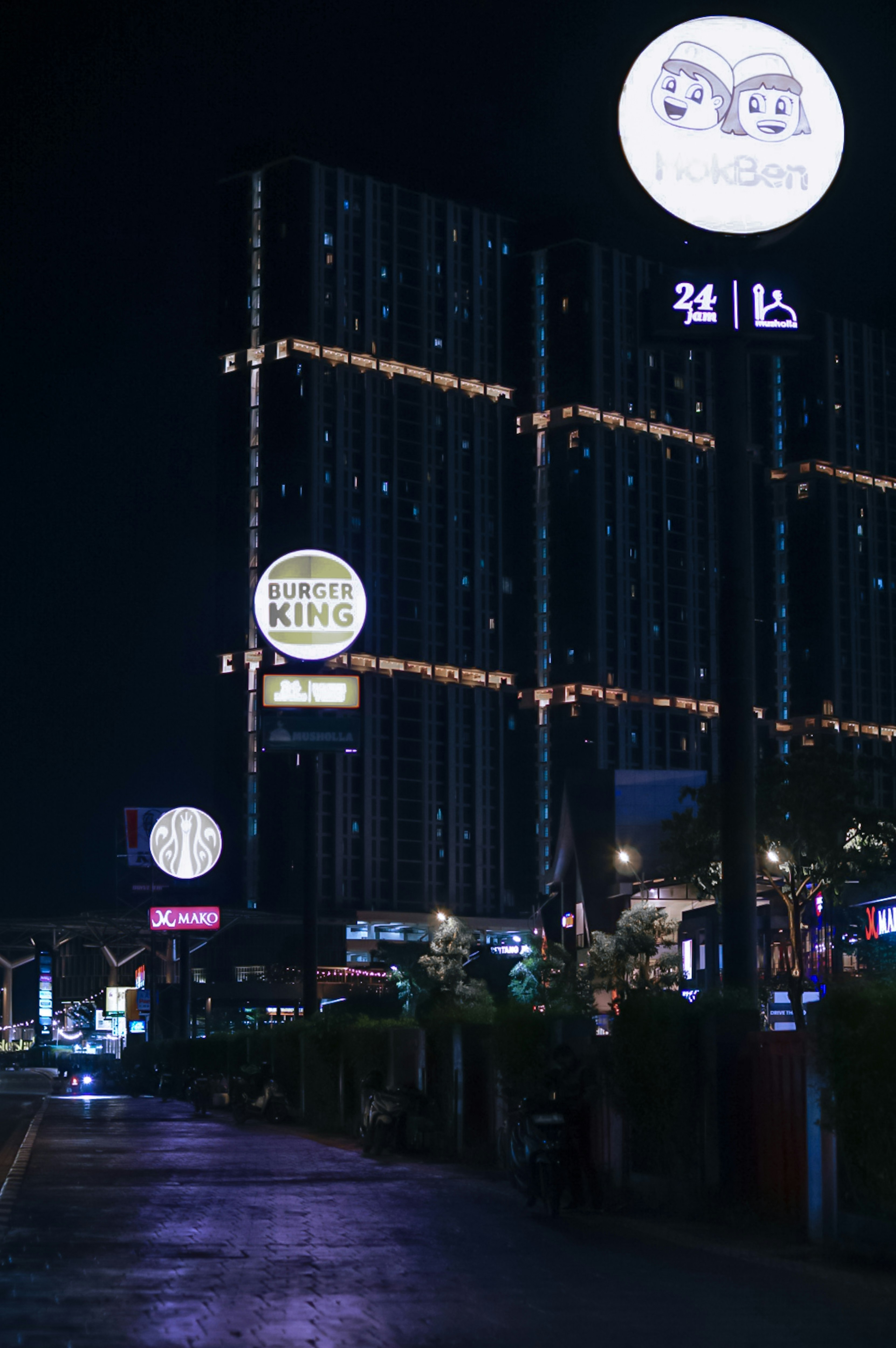 Neon Nightfall: Burger King Signage Under City Towers