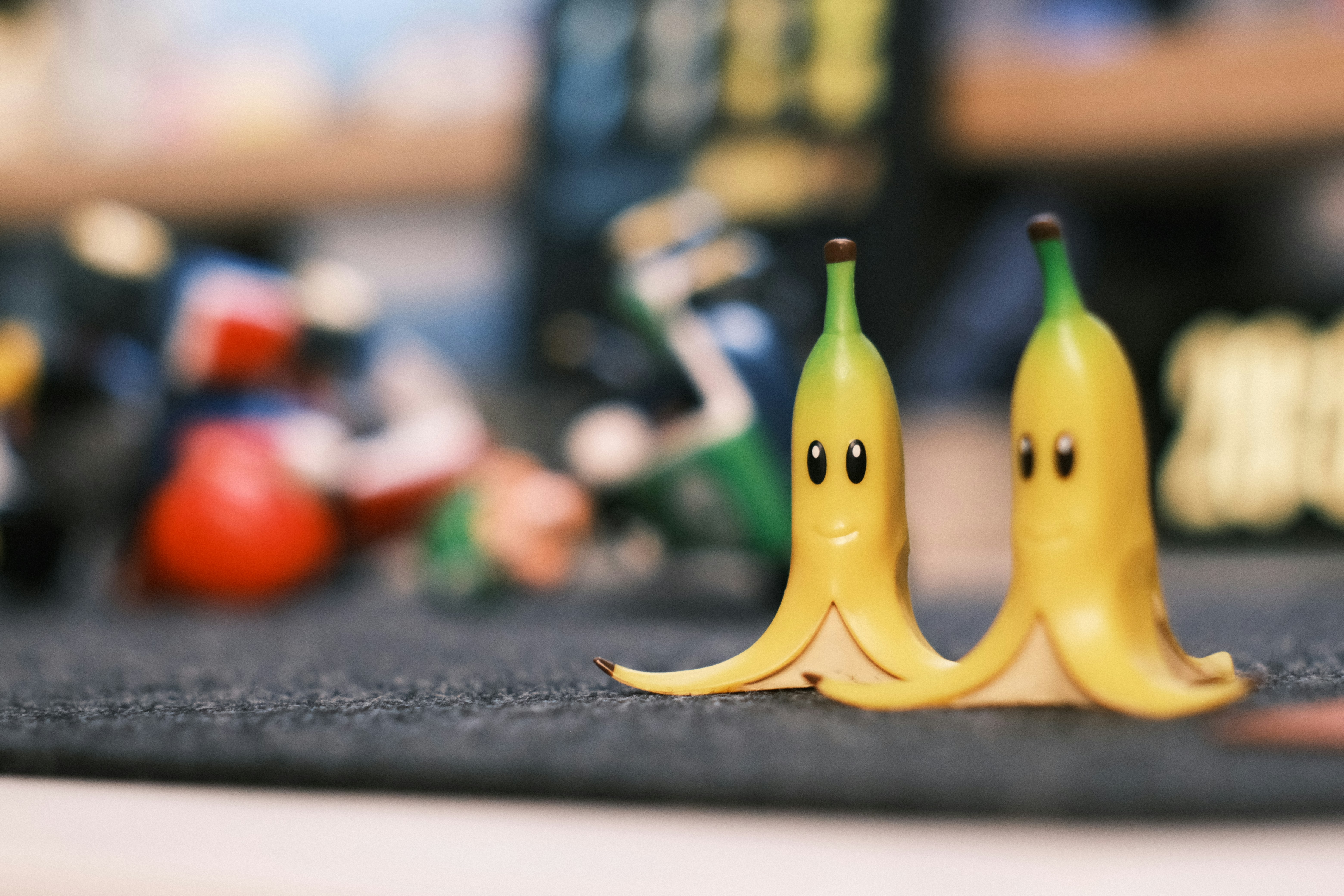 Two Smiling Bananas Guard the Rugged World of Toy Terrain