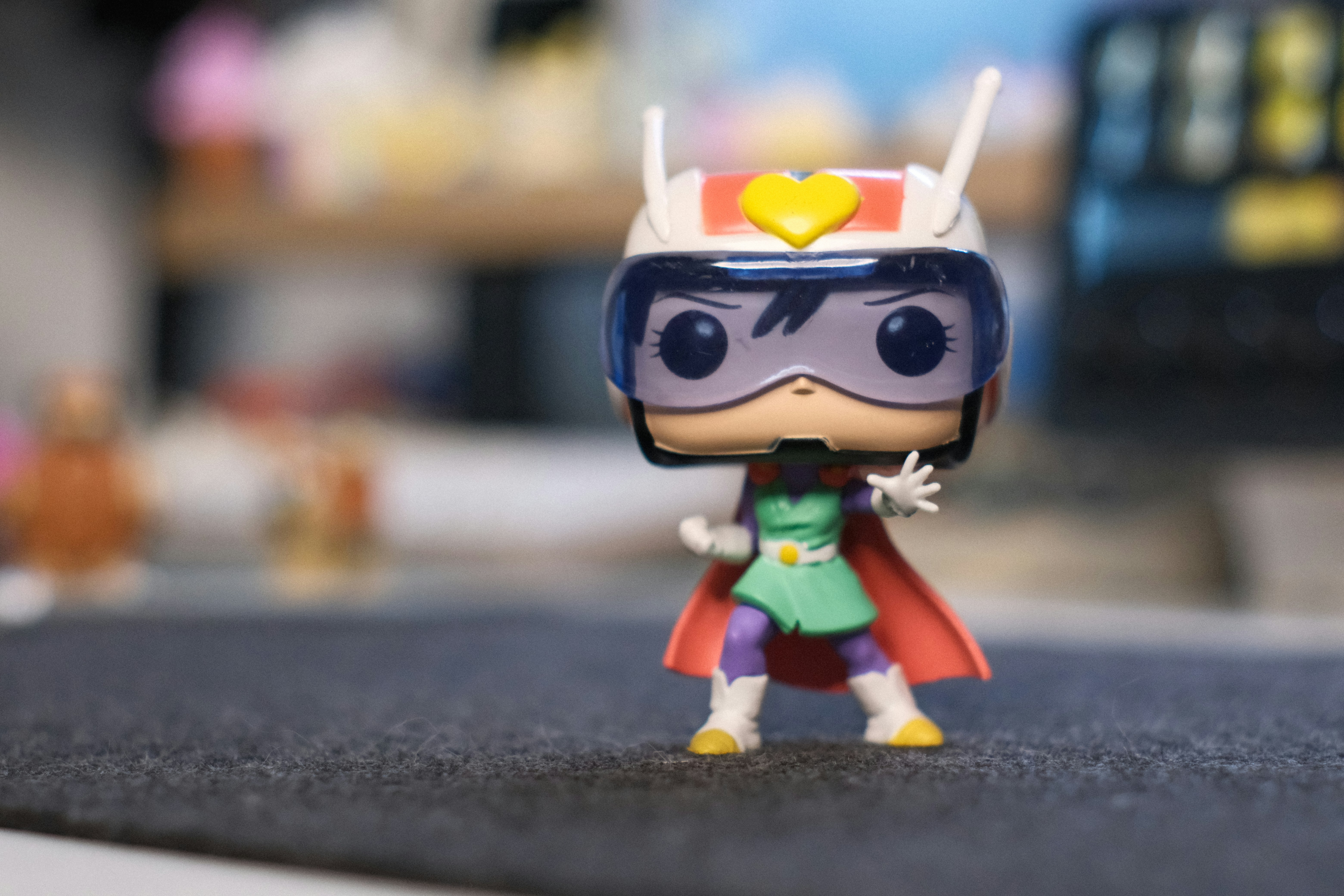 Heroic mini figure on a blurred tabletop stage