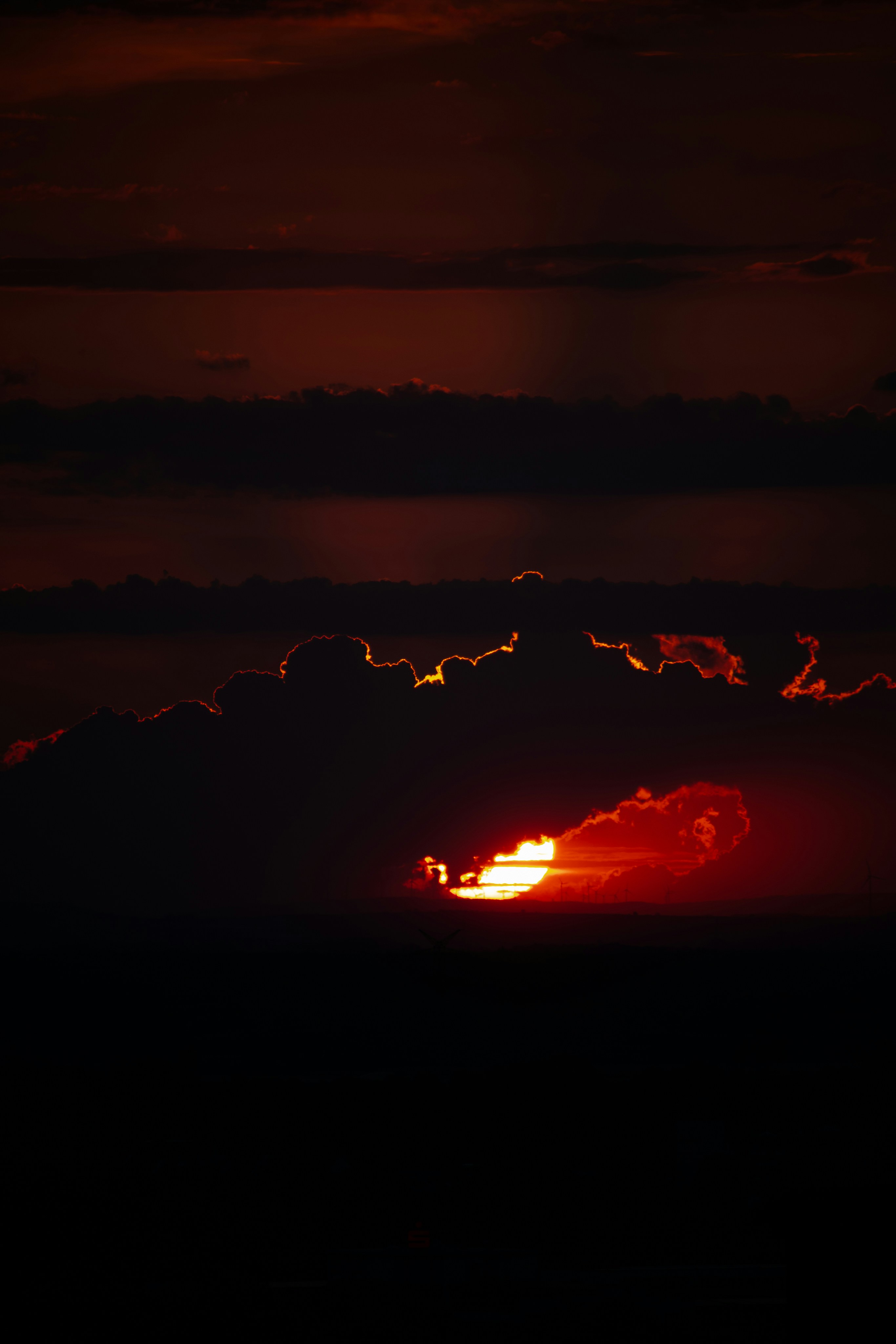 Crimson Horizon: Sunlit Edges of a Low Horizon Cloudbank