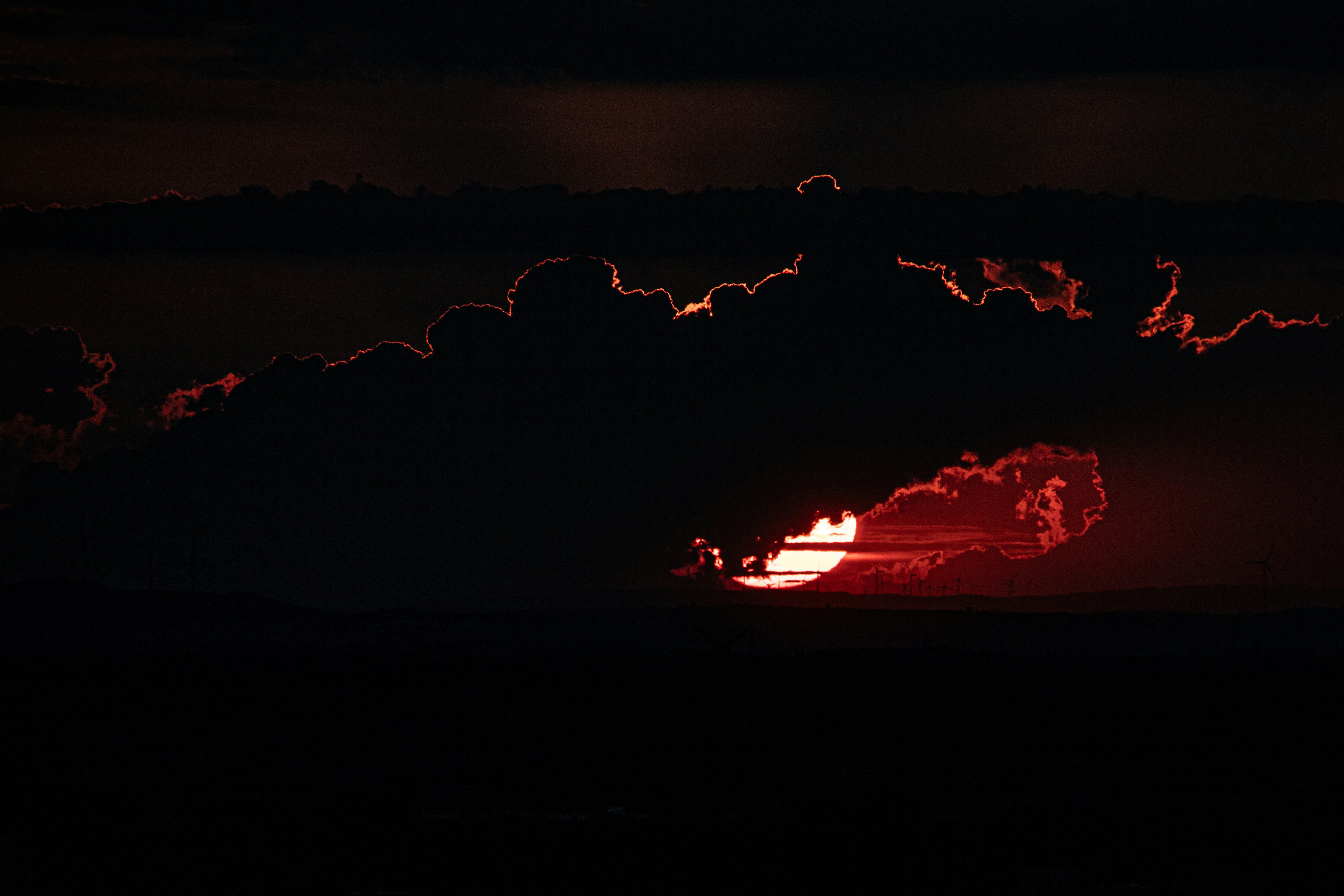 Fiery Break: A Sun-Kissed Edge Emerges from a Dark Horizon