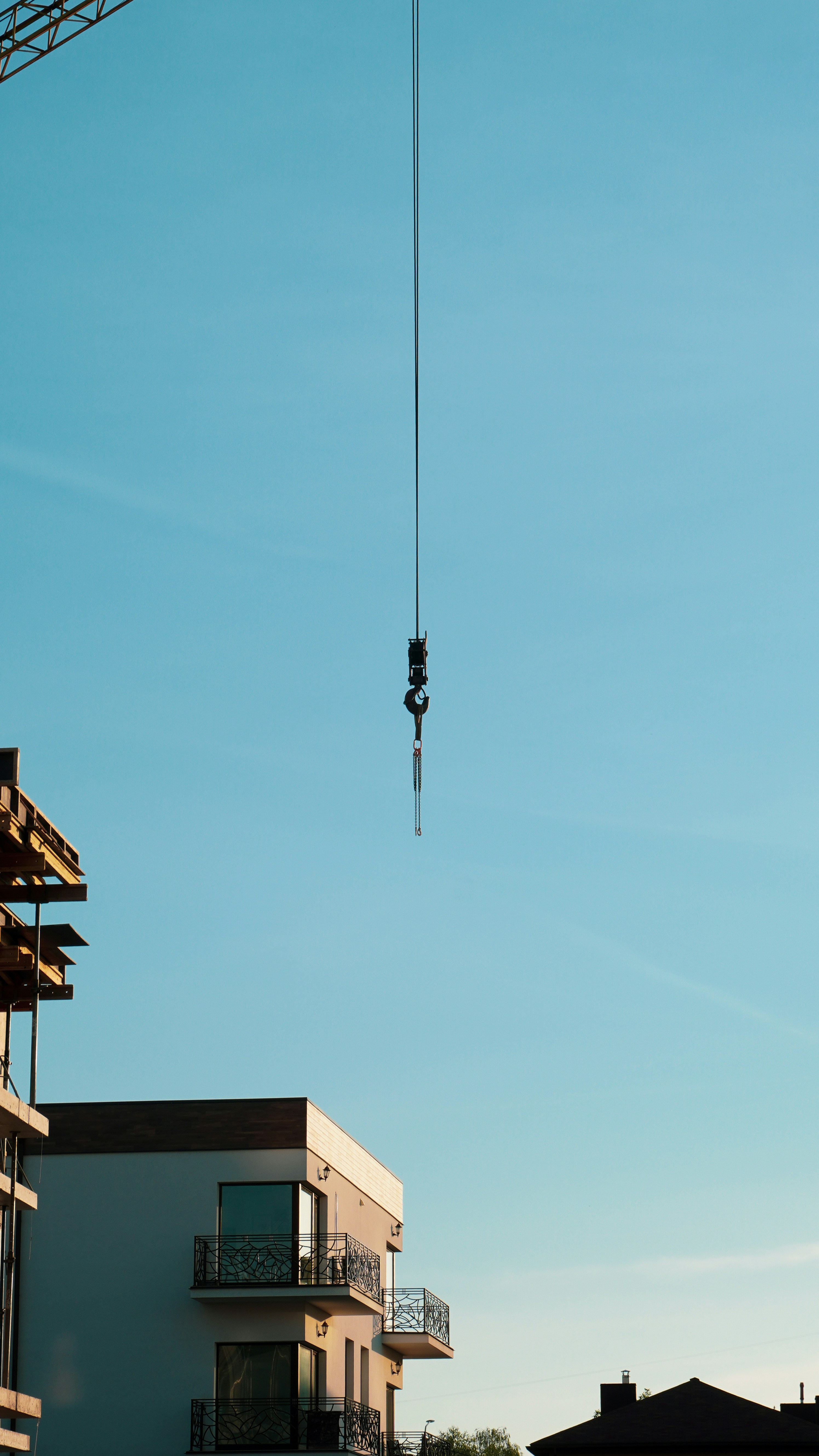 Midair Crane Hook Null: A Vertical Line Between Sky and City