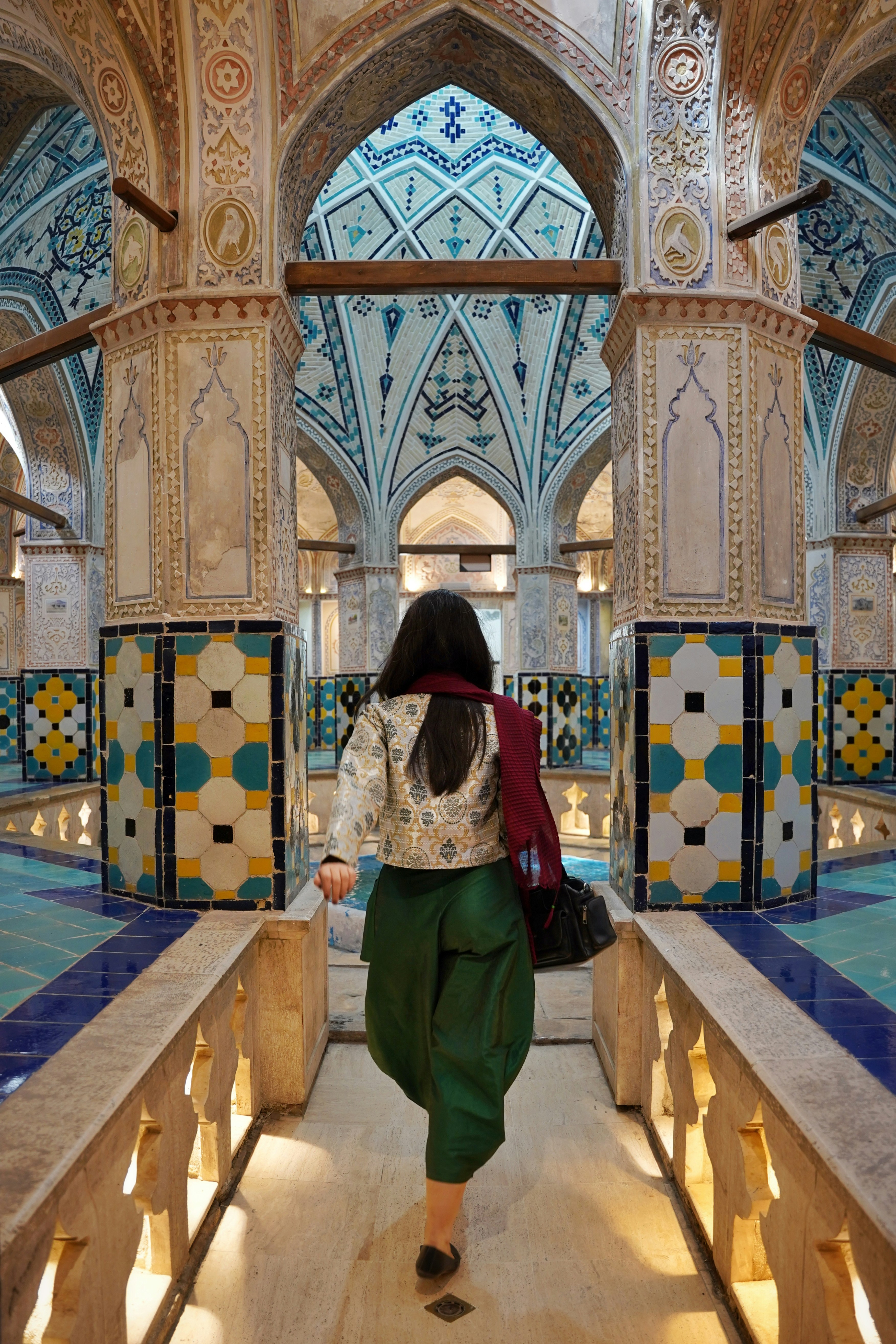 Traveler in an Ornate Persian Hallway