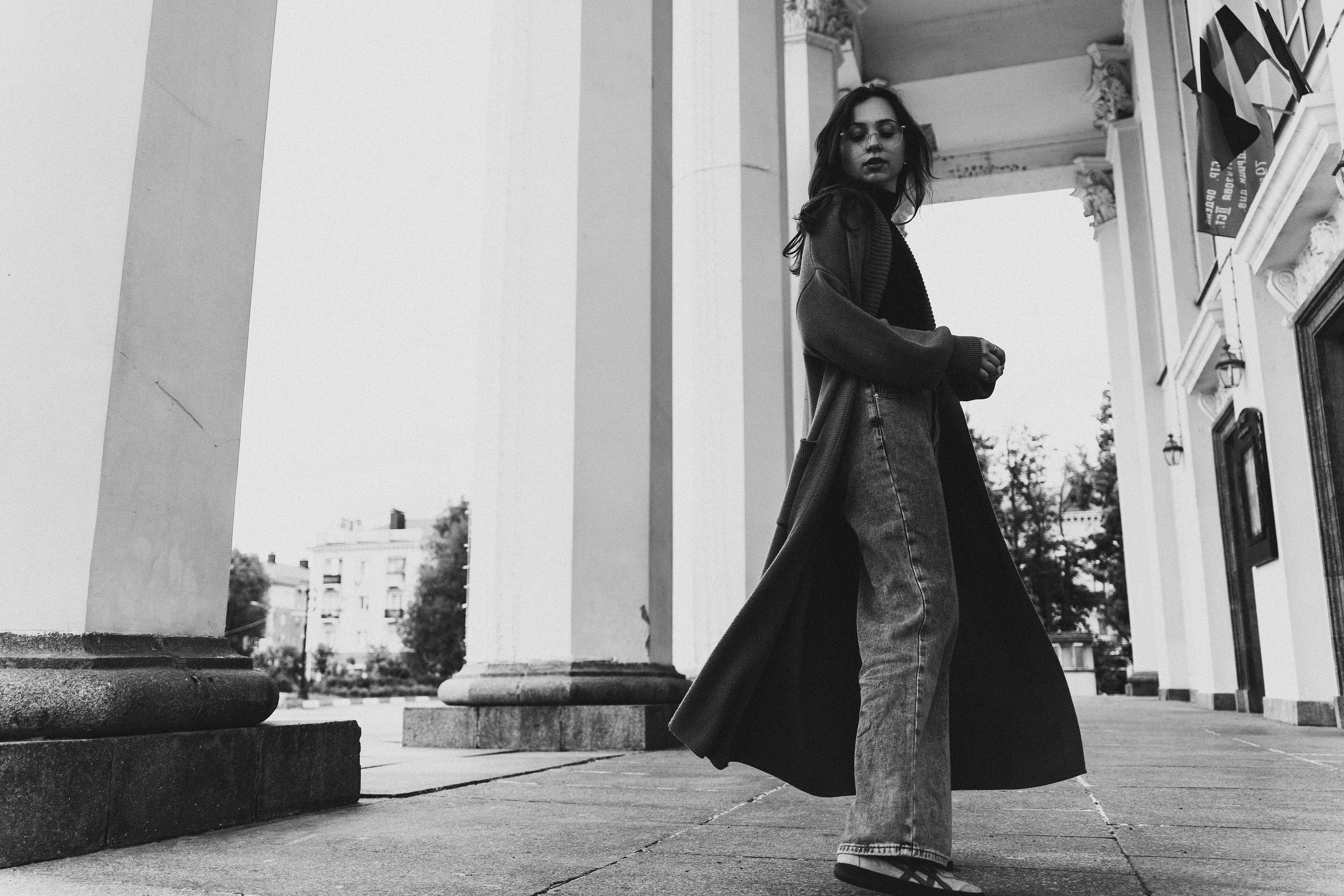 Midstride in Monochrome: A Portrait at the Columns
