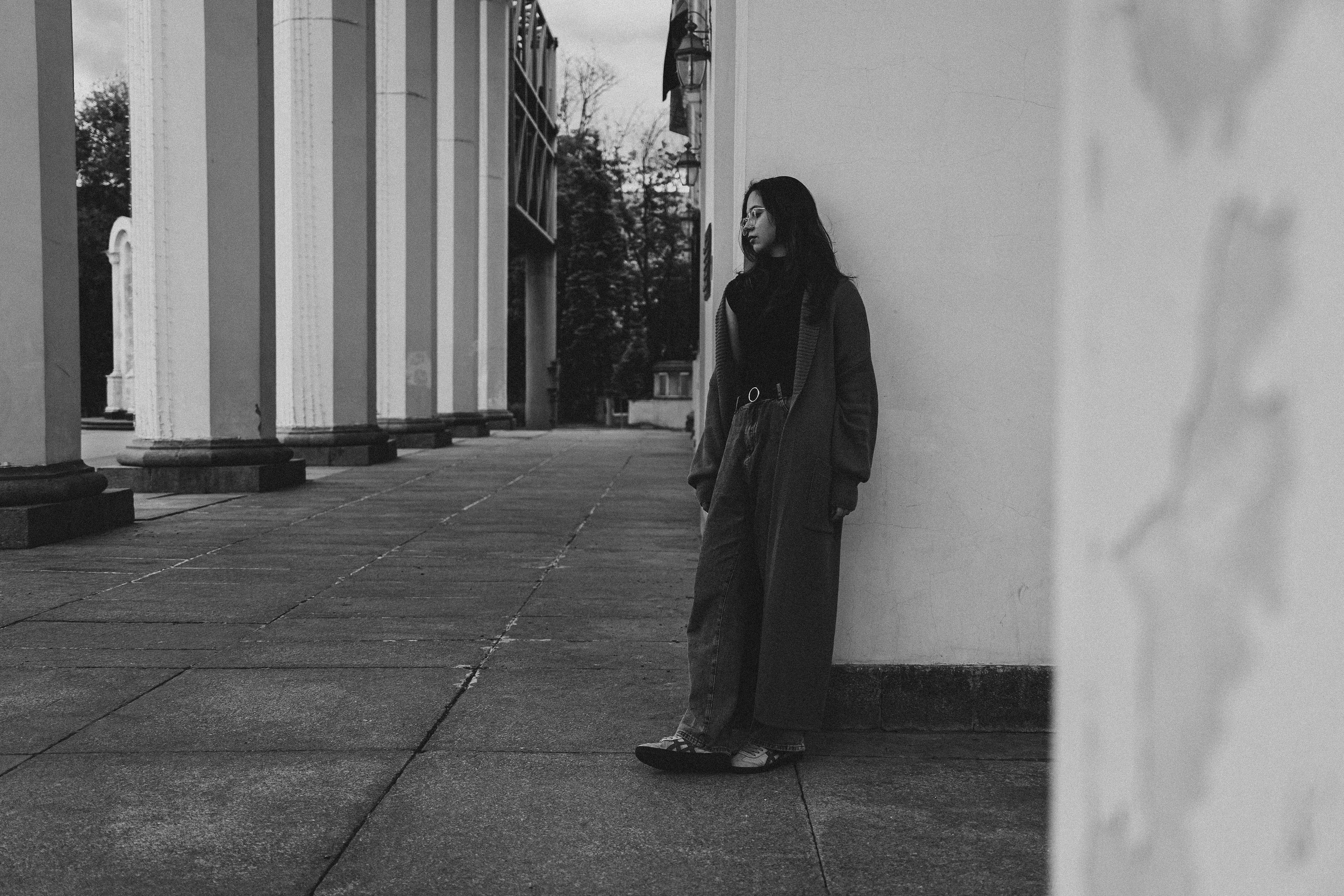 Shadowed Figure by the Colonnade