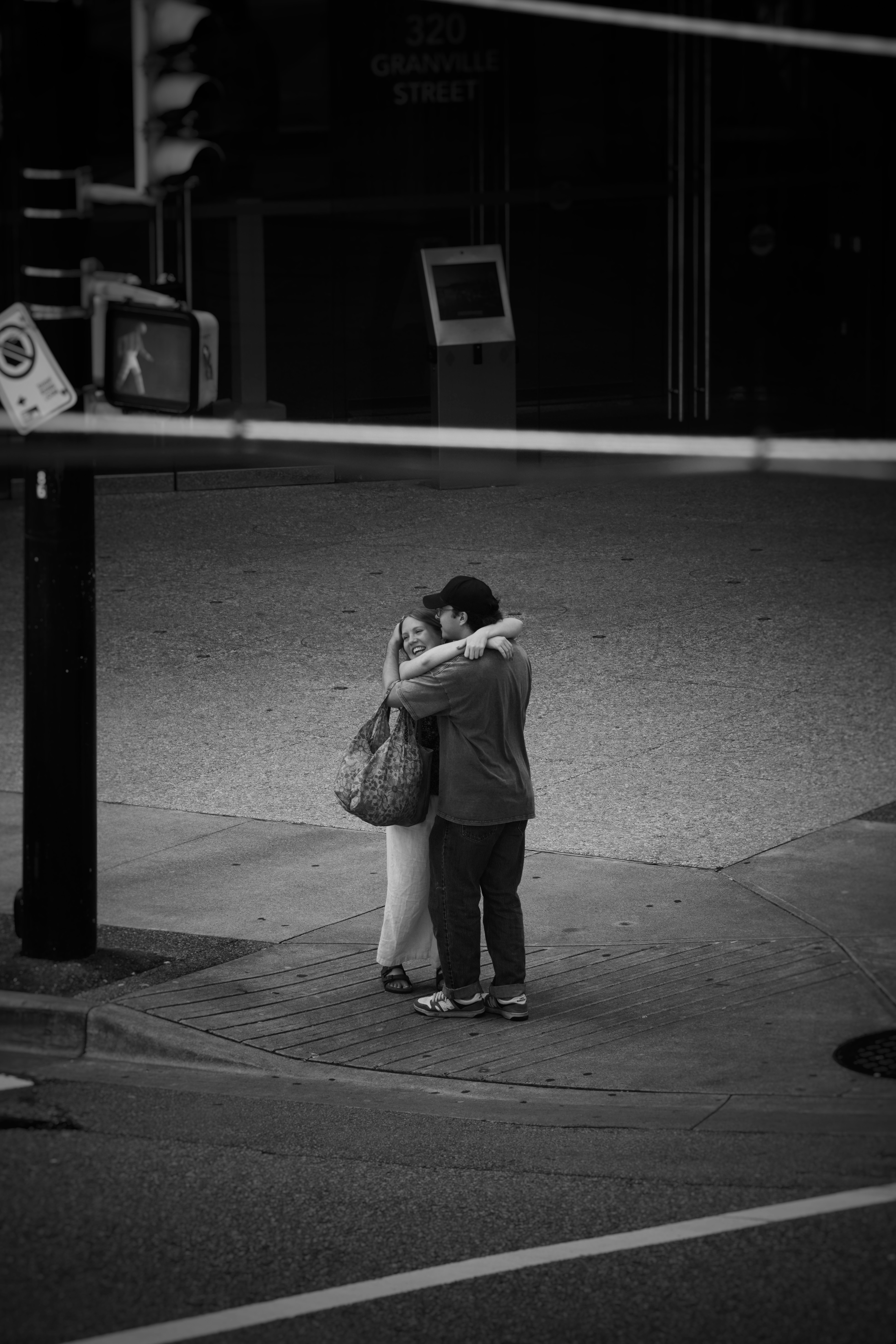 Embrace at Dawn: A Quiet Moment on the Corner