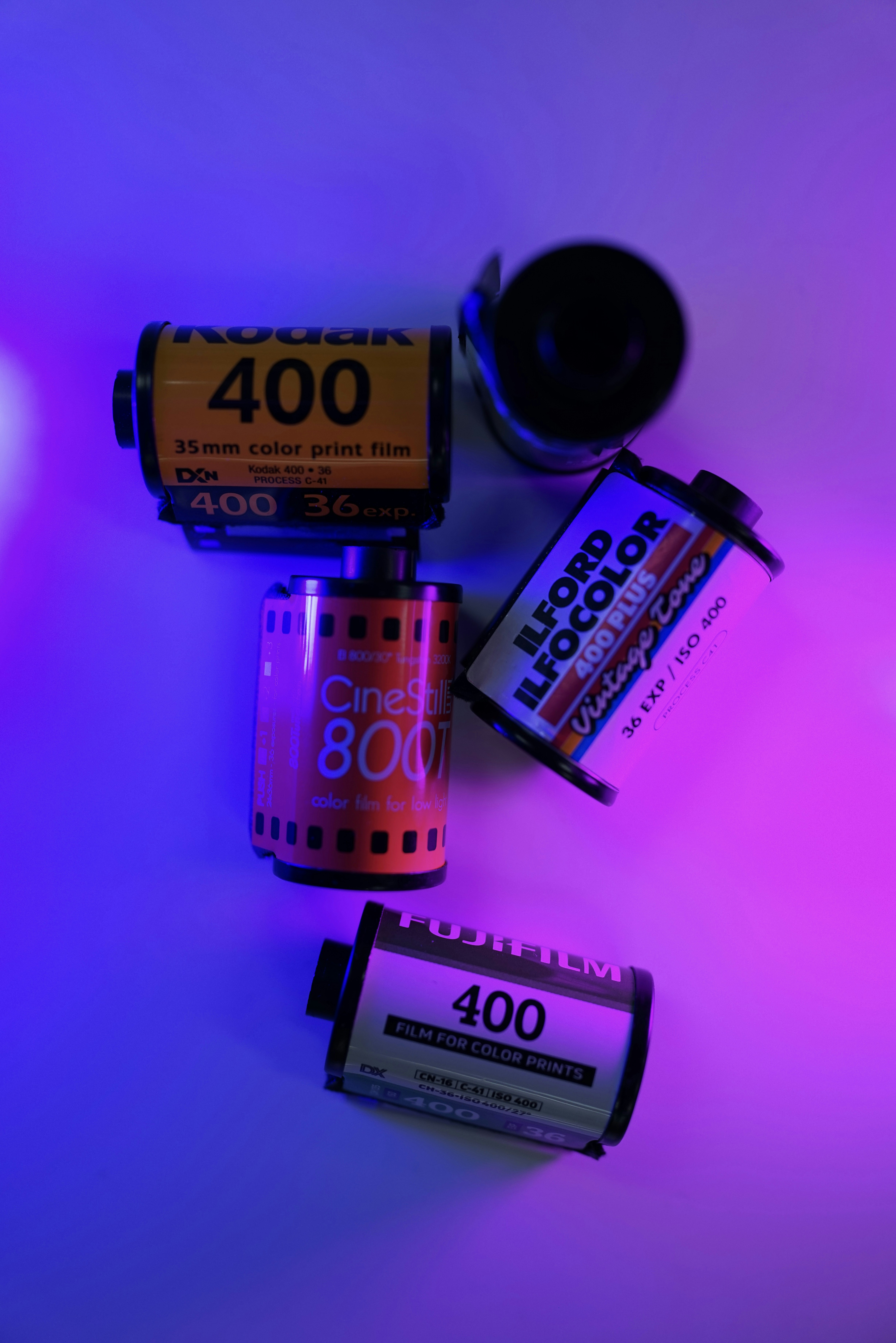 Chromatic Shells: Vintage Film Canisters in Neon Glow