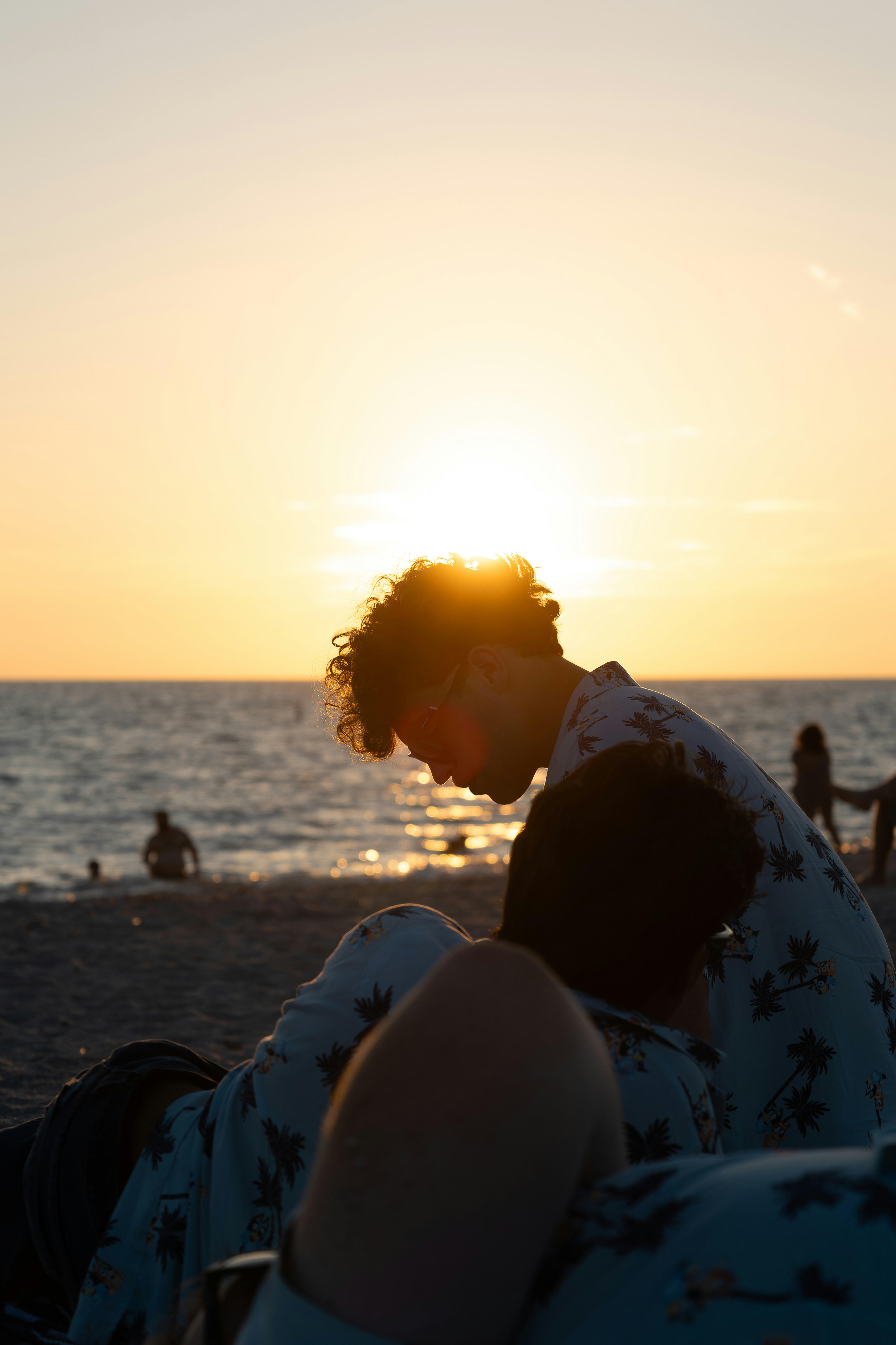 Sunset Silhouette: Intimate Moment by the Shore