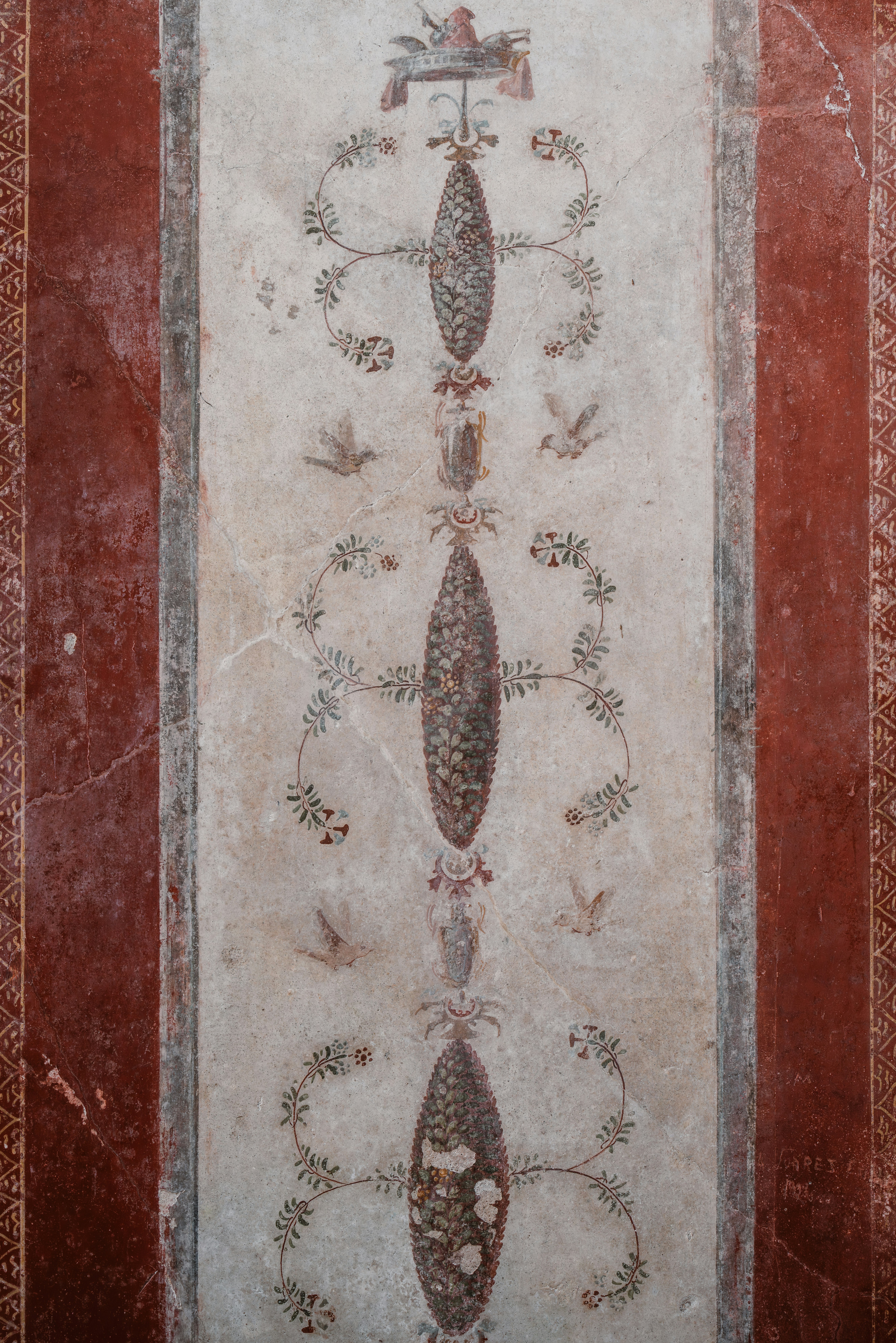 Vertical Frieze: Three Ornamental Medallions in a Red-Walled Panel