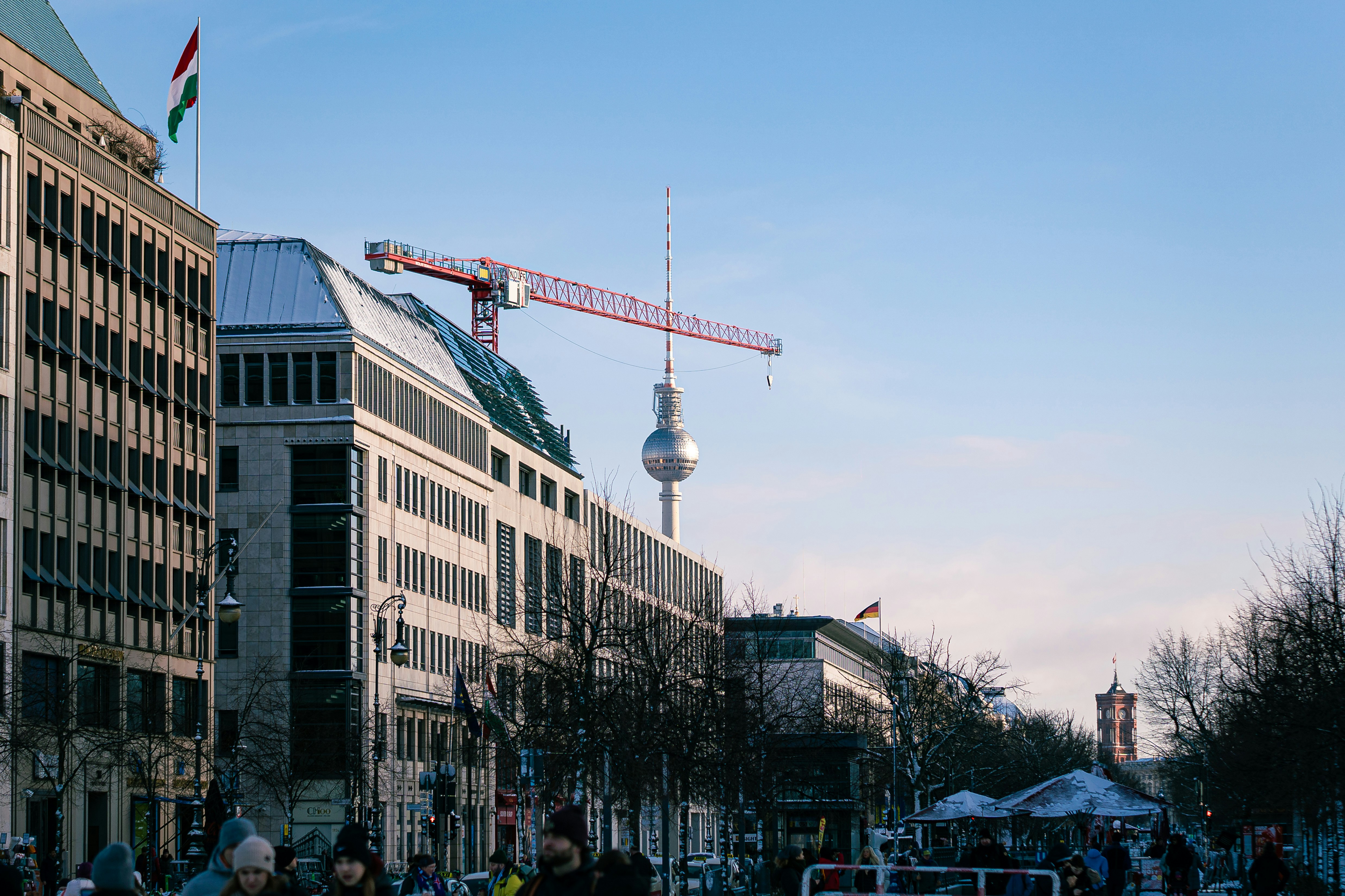 Cranes Over a City Street: Snowy Market Under Construction