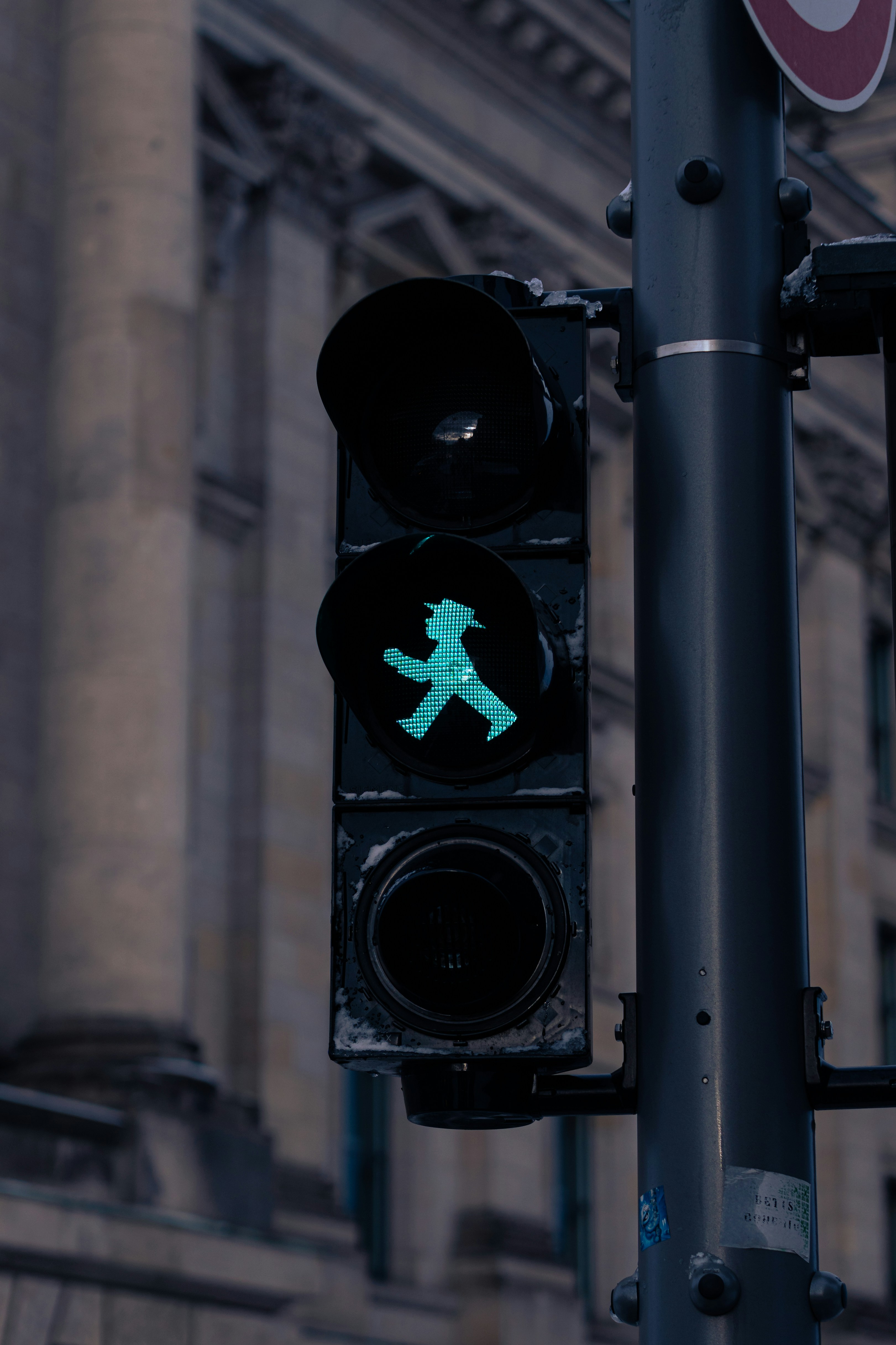 Green Pedestrian Icon Illuminated on Urban Traffic Signal