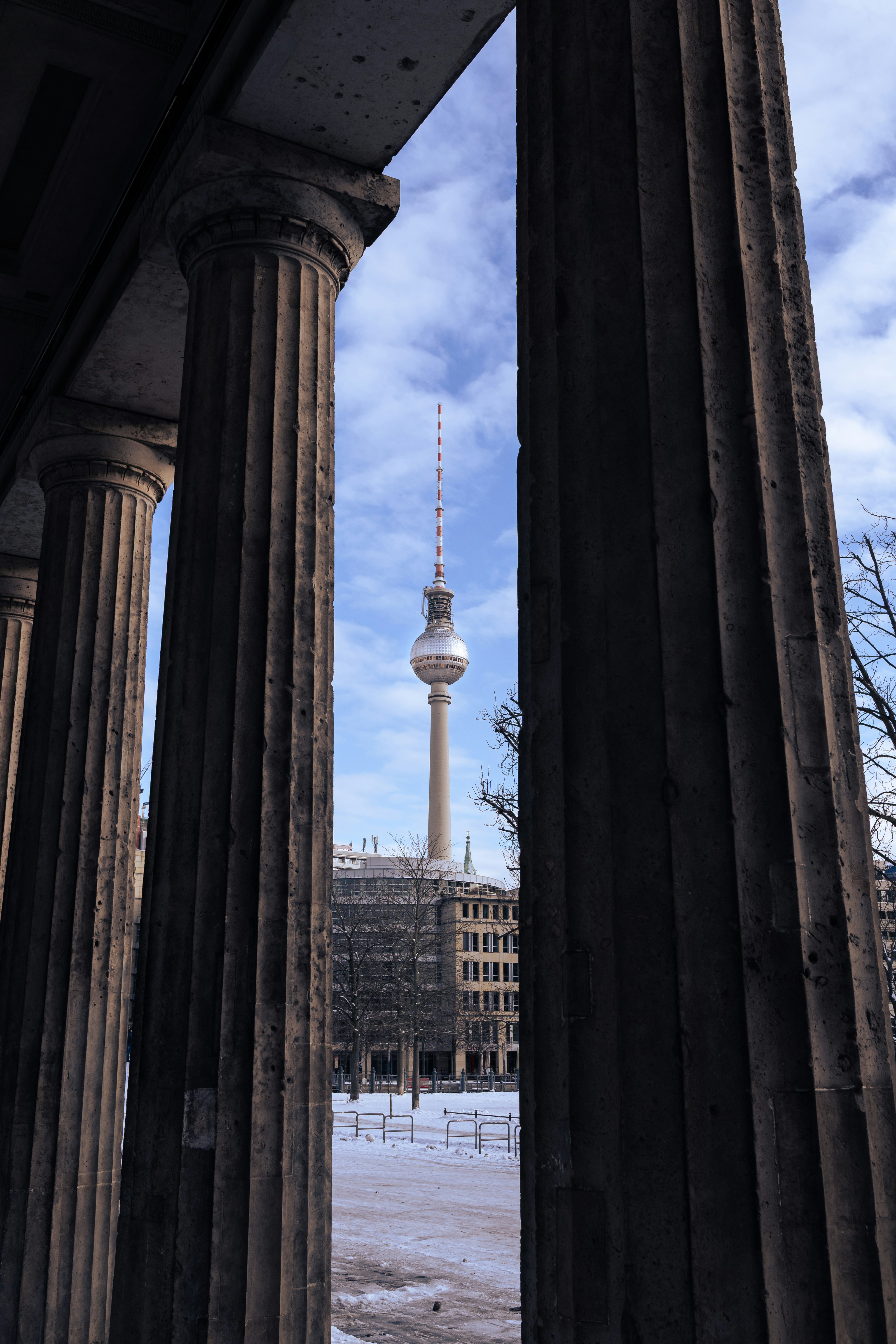 Through the Classical Columns, Berlin’s Fernsehturm Emerges