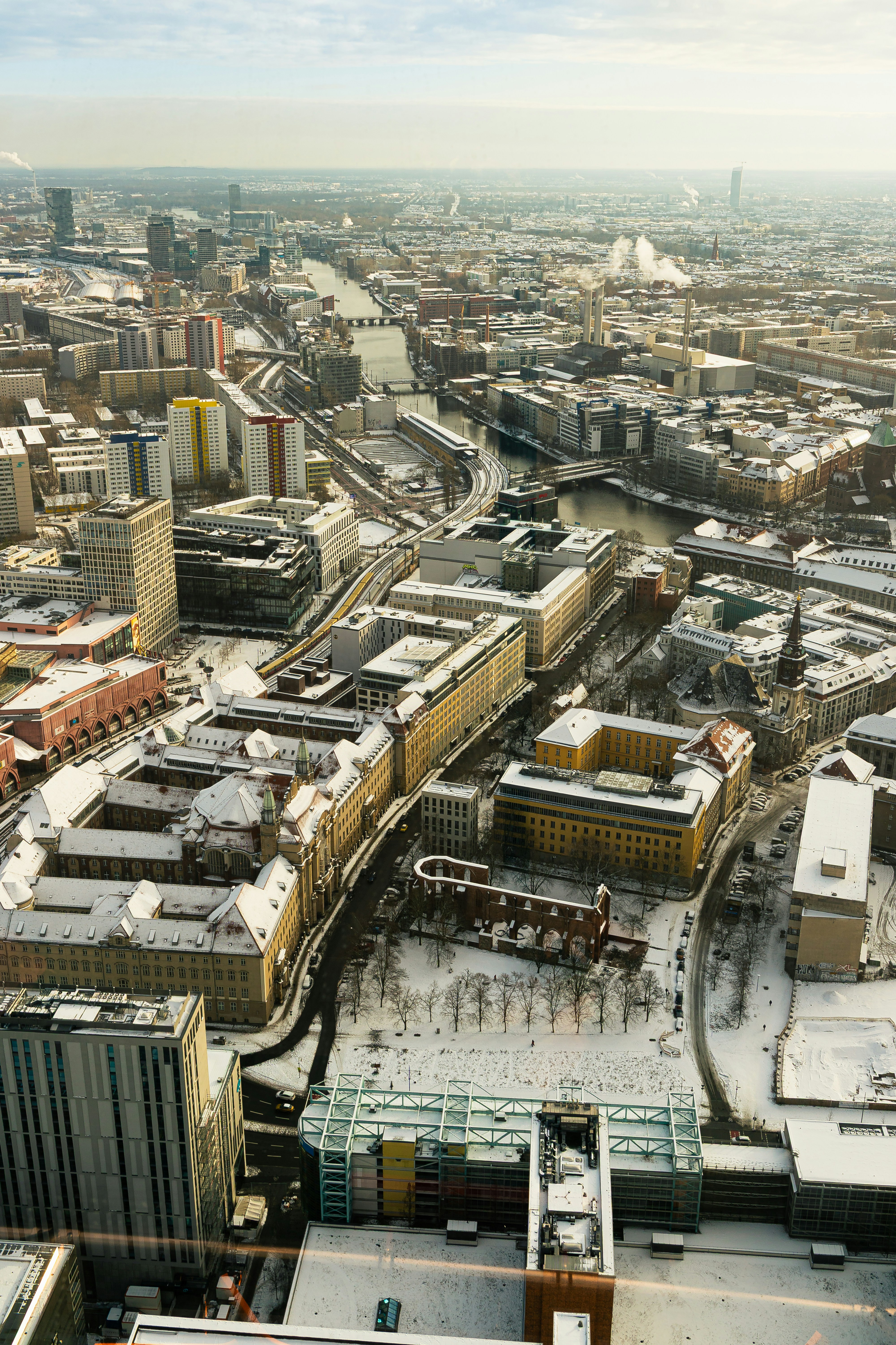 Snowy City Grid: A Tangle of Rails and Rivers Under Winter Light